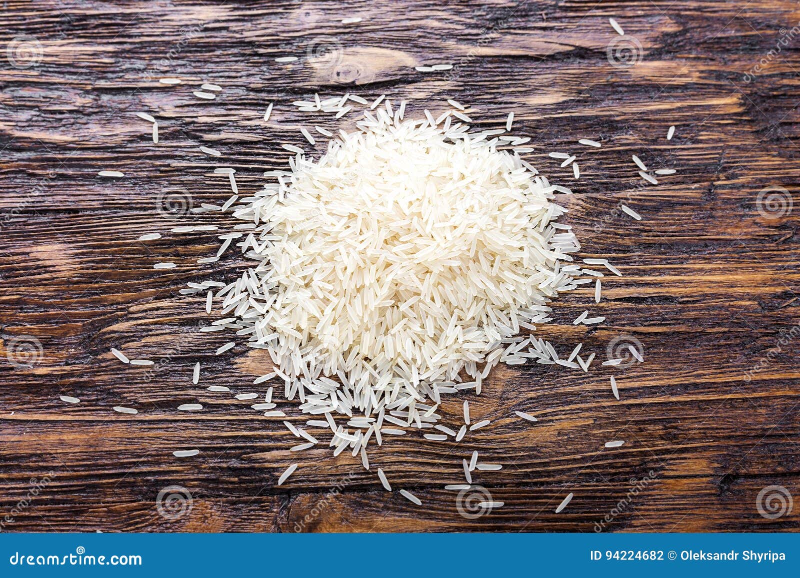 Uncooked rice is scattered stock photo. Image of background - 94224682