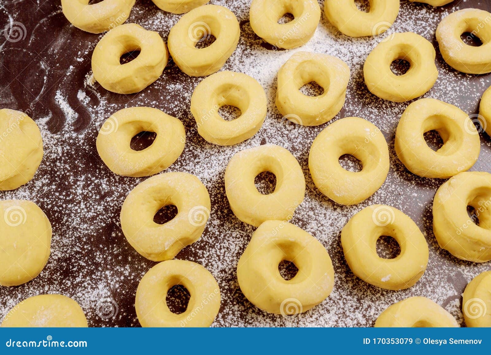Uncooked Round Donuts on Table with Flour before Frying Stock Image ...