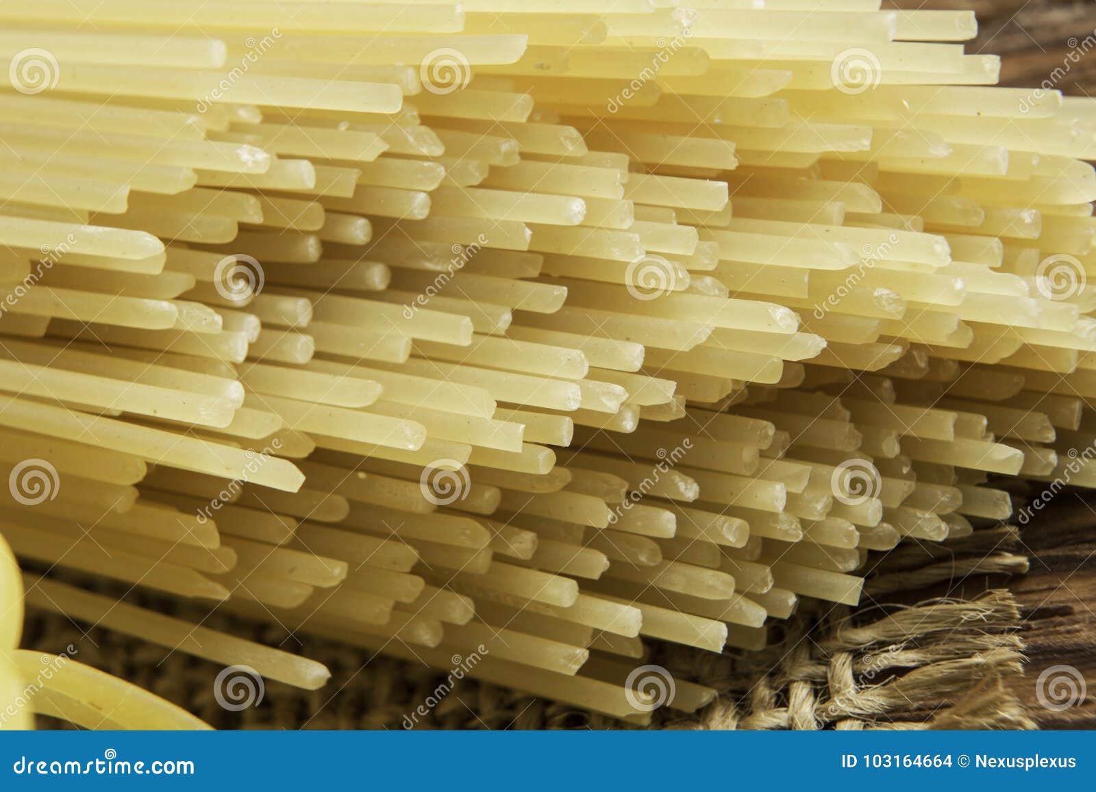 Uncooked Spaghetti on Table Stock Photo - Image of yellow, macaroni ...