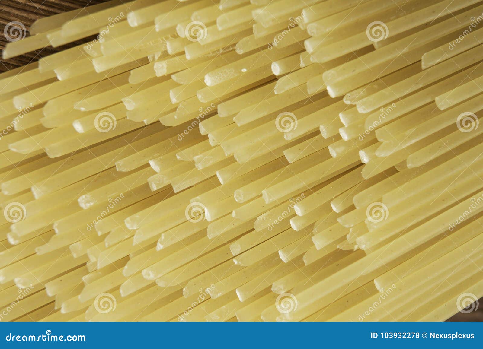 Uncooked Spaghetti on Table Stock Photo - Image of uncooked, cooking ...