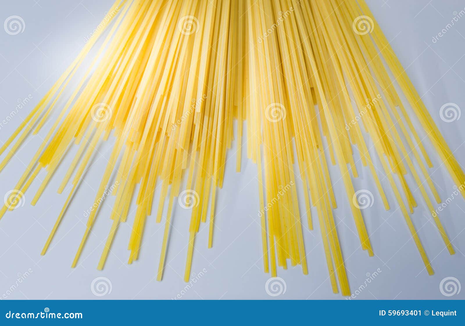 Uncooked yellow spaghetti stock image. Image of yellow - 59693401