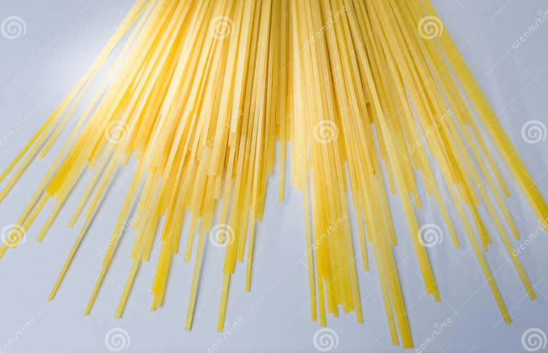 Uncooked yellow spaghetti stock image. Image of yellow - 59693401