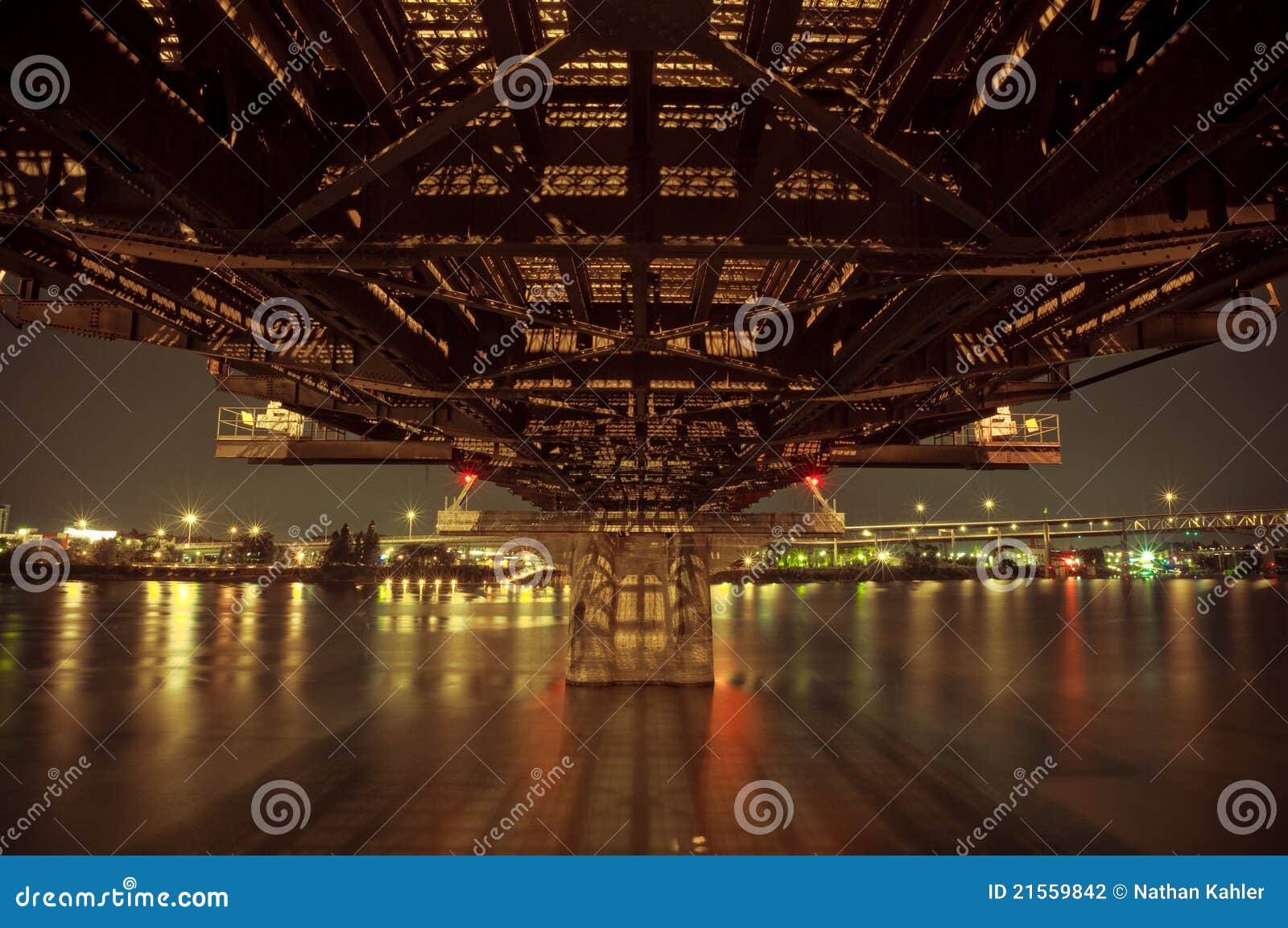 Under a Bridge at Night with City Lights Stock Photo - Image of bridge ...