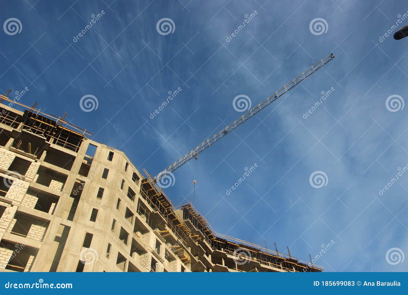 Under Construction New Condominium Building Under Blue Sky with Feather ...