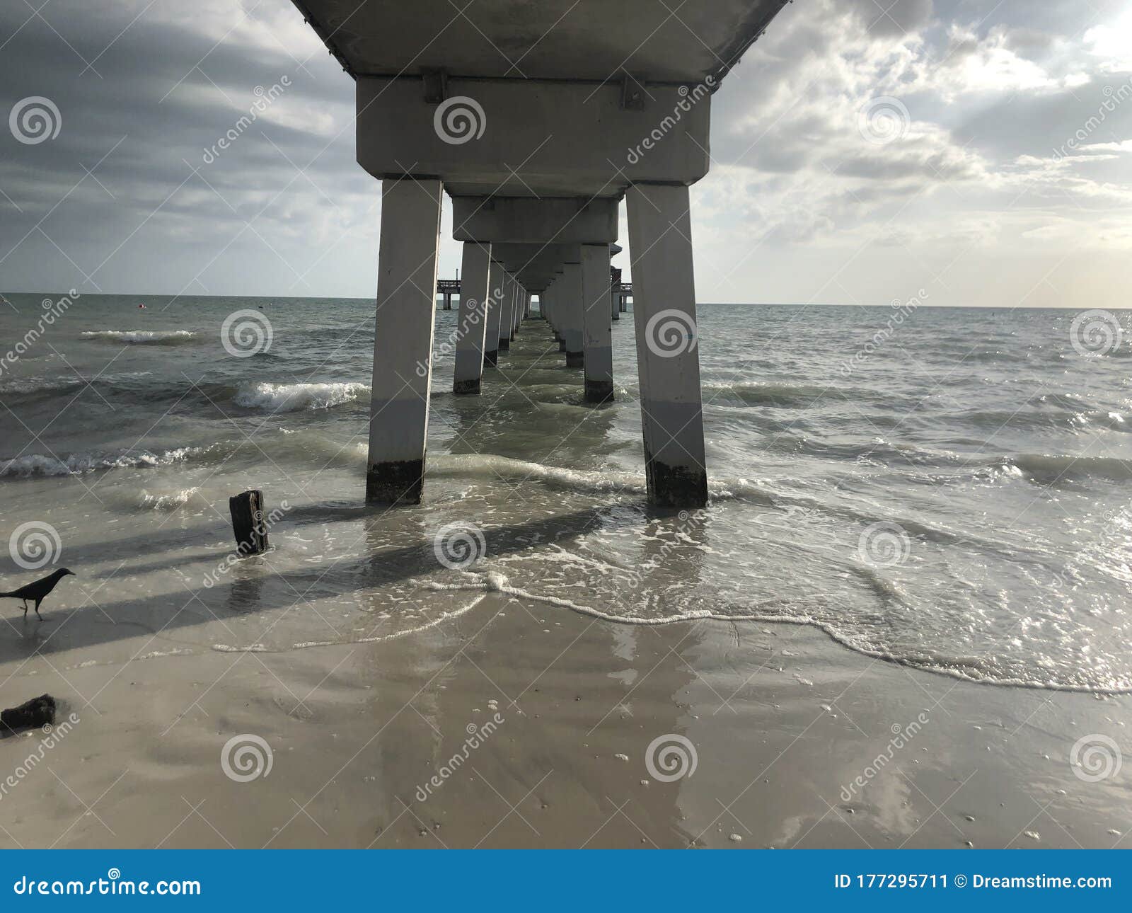 Under a pier stock image. Image of ocean, sunset, warmth - 177295711