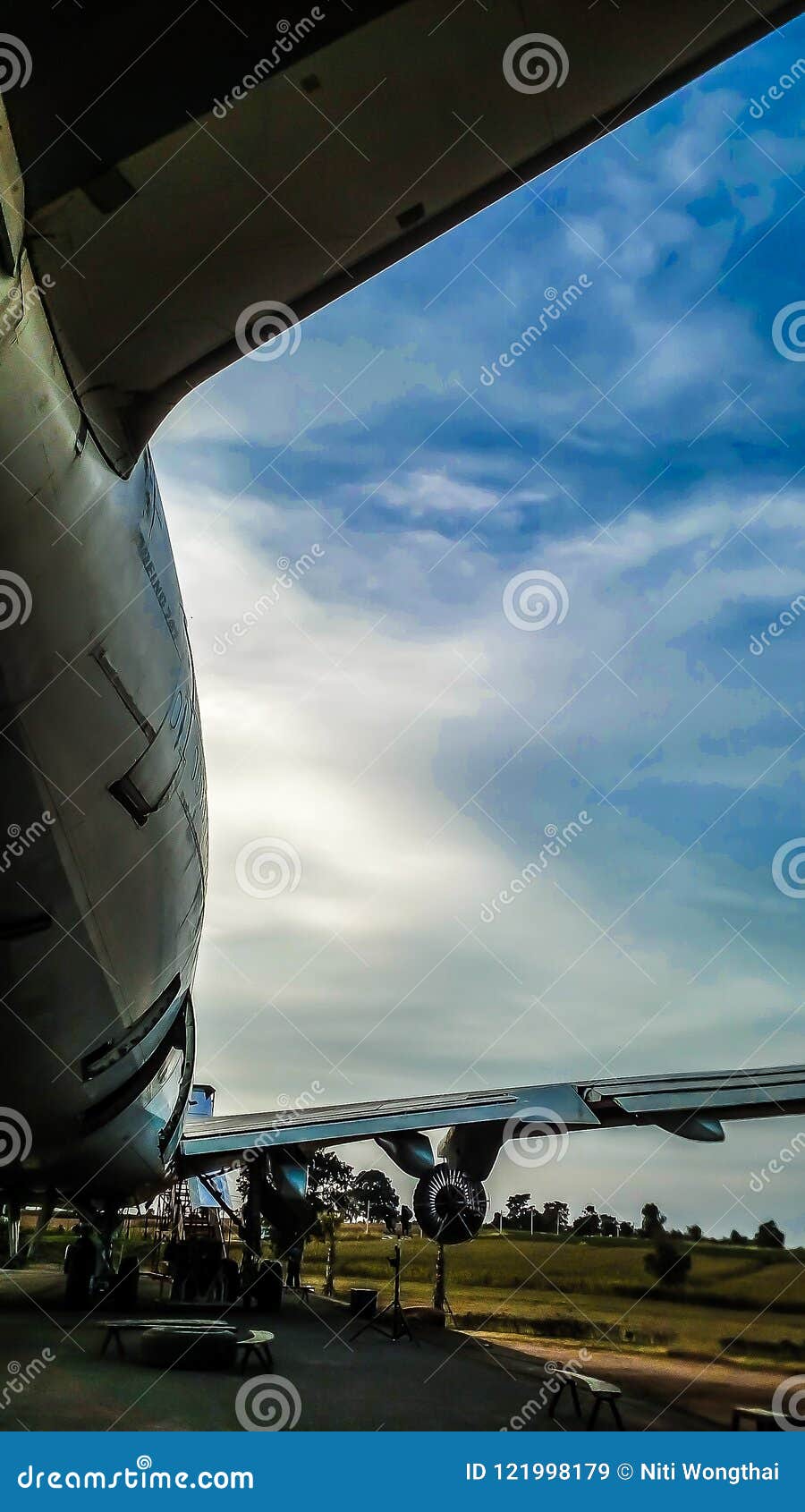 Under the Plane, the Passenger Plane in the Middle of the Field. Stock ...
