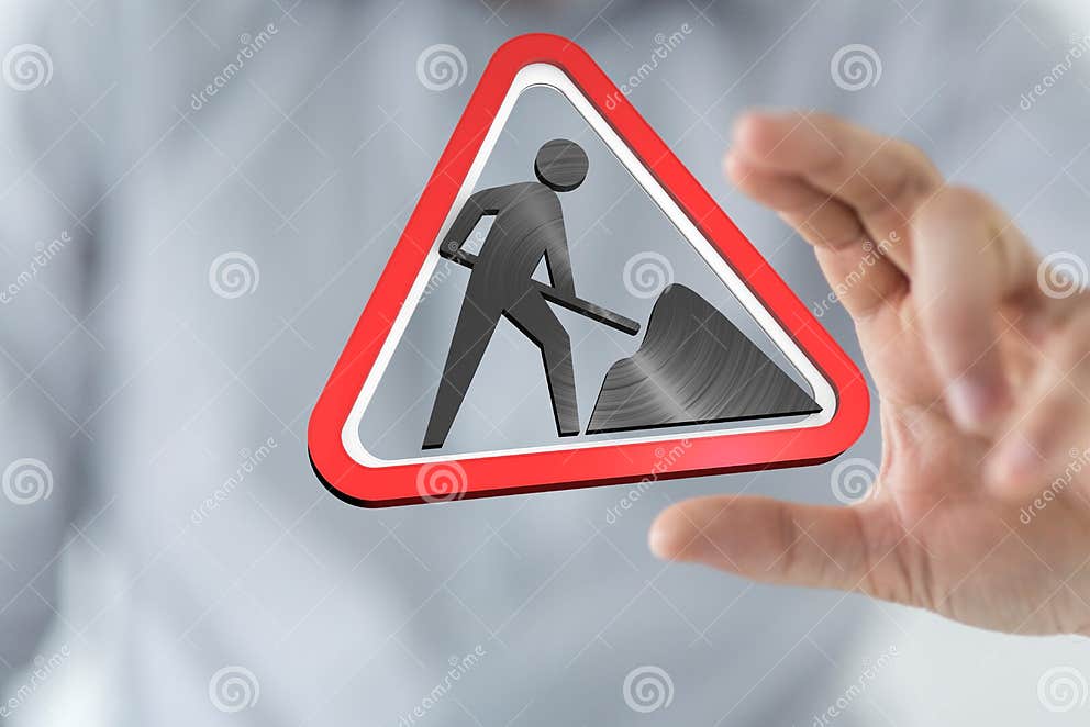 A Under Process Sign in Hand Stock Photo - Image of construction ...