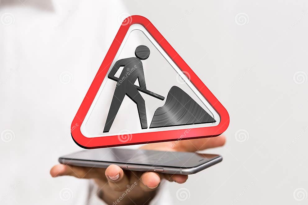 A Under Process Sign in Hand Stock Photo - Image of road, symbol: 181274794