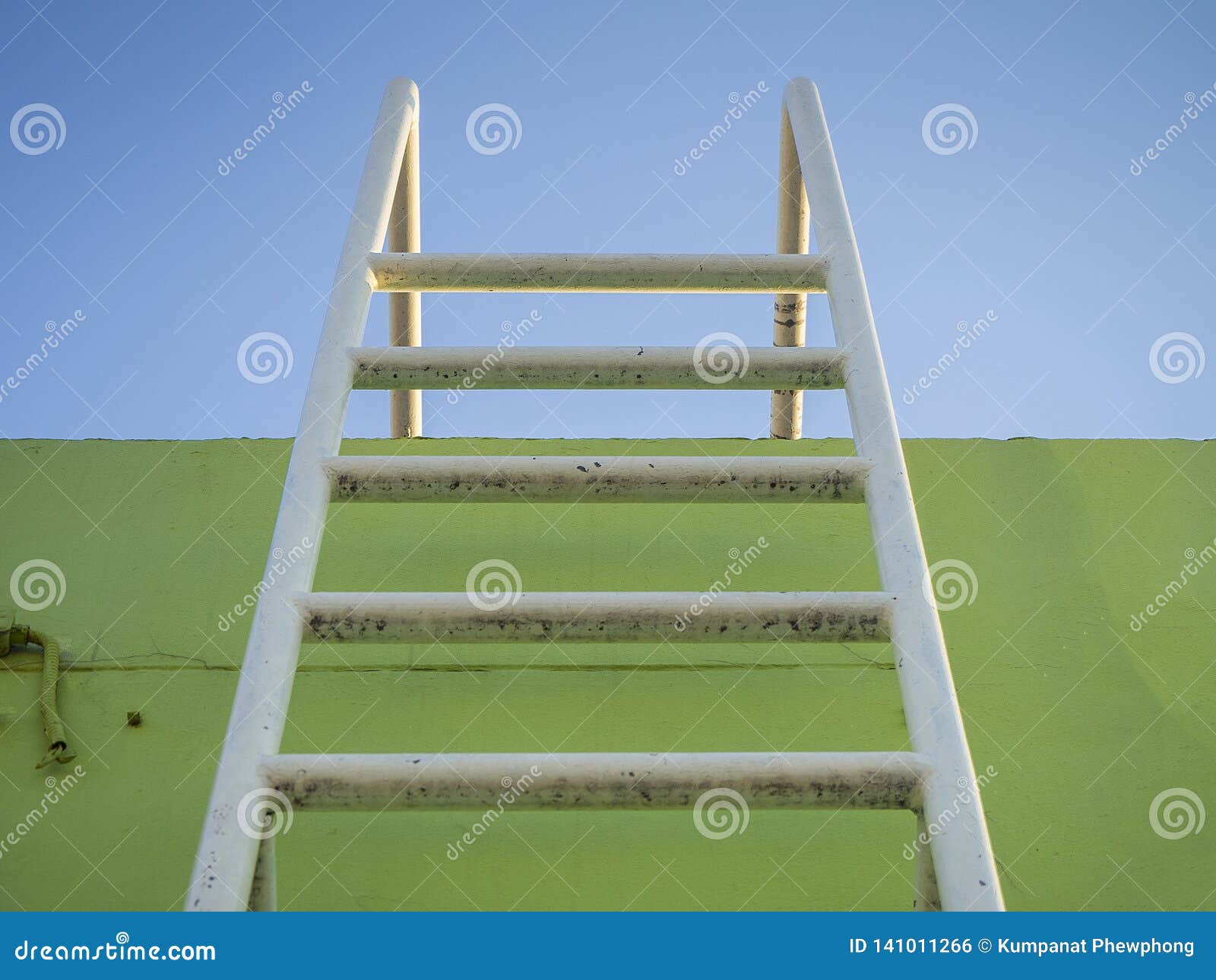 Under View of Steel Ladder on Green Background and Blue Sky Stock Photo ...