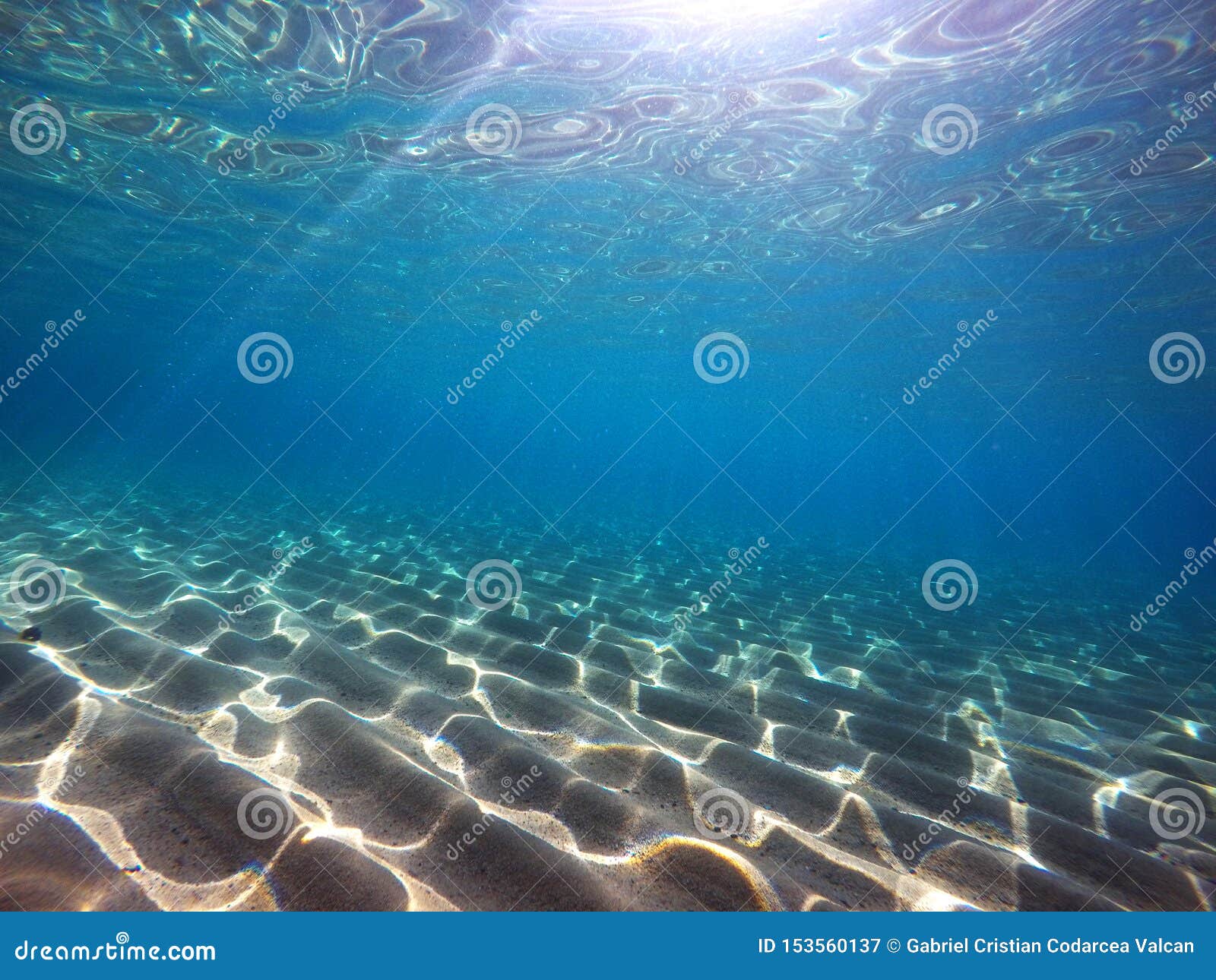 Under Water Shot with Sun Rays on the Sand Stock Image - Image of ...