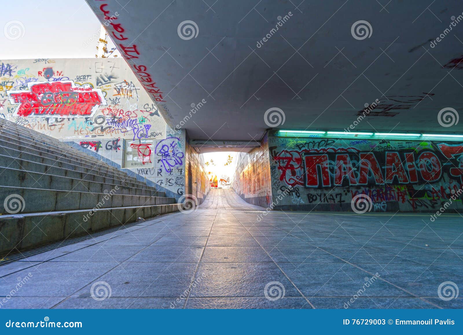 Underground Passage With Metal Stairs Leading To A Building Covered In ...