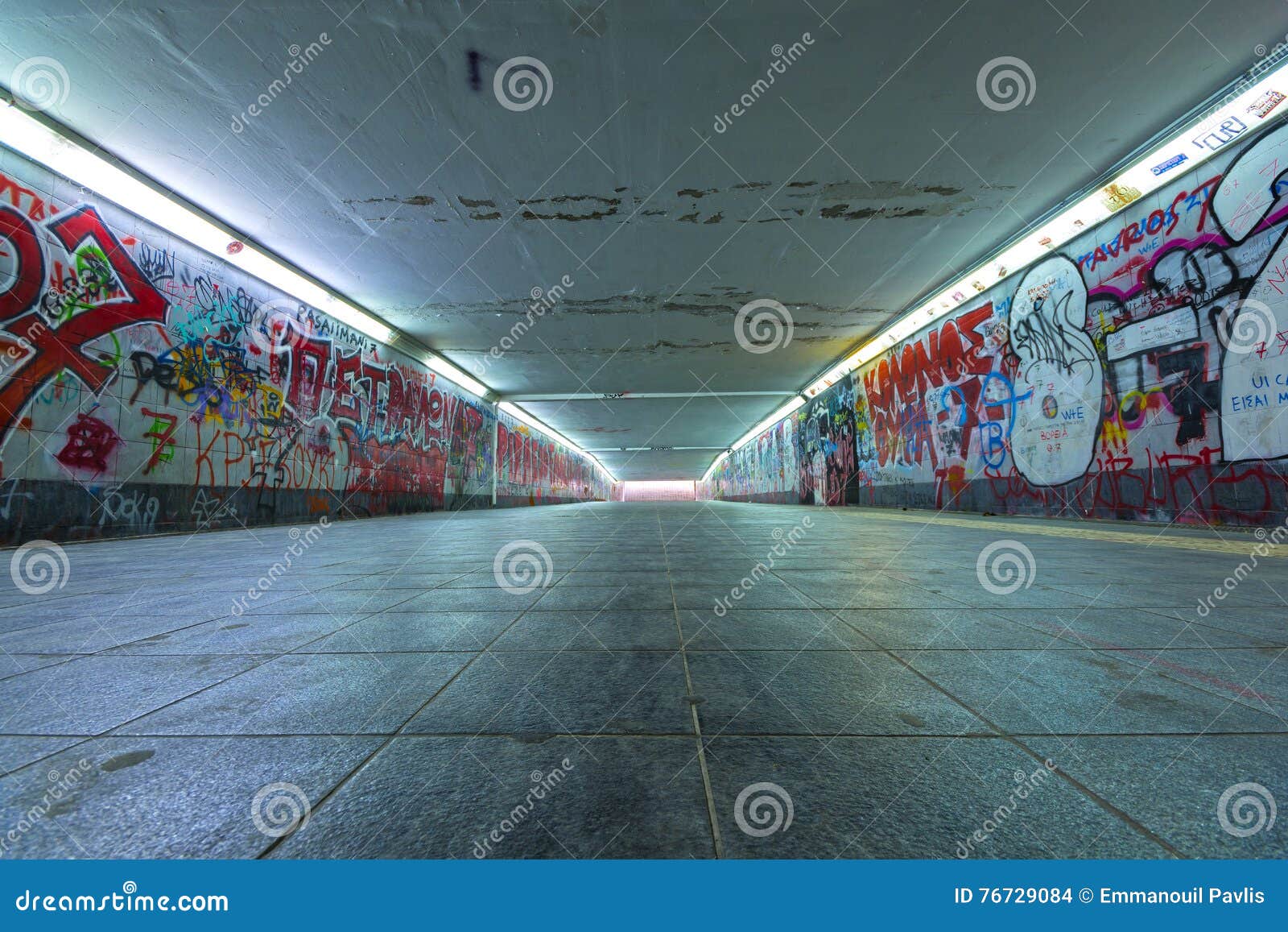 Underground Passage With Metal Stairs Leading To A Building Covered In ...