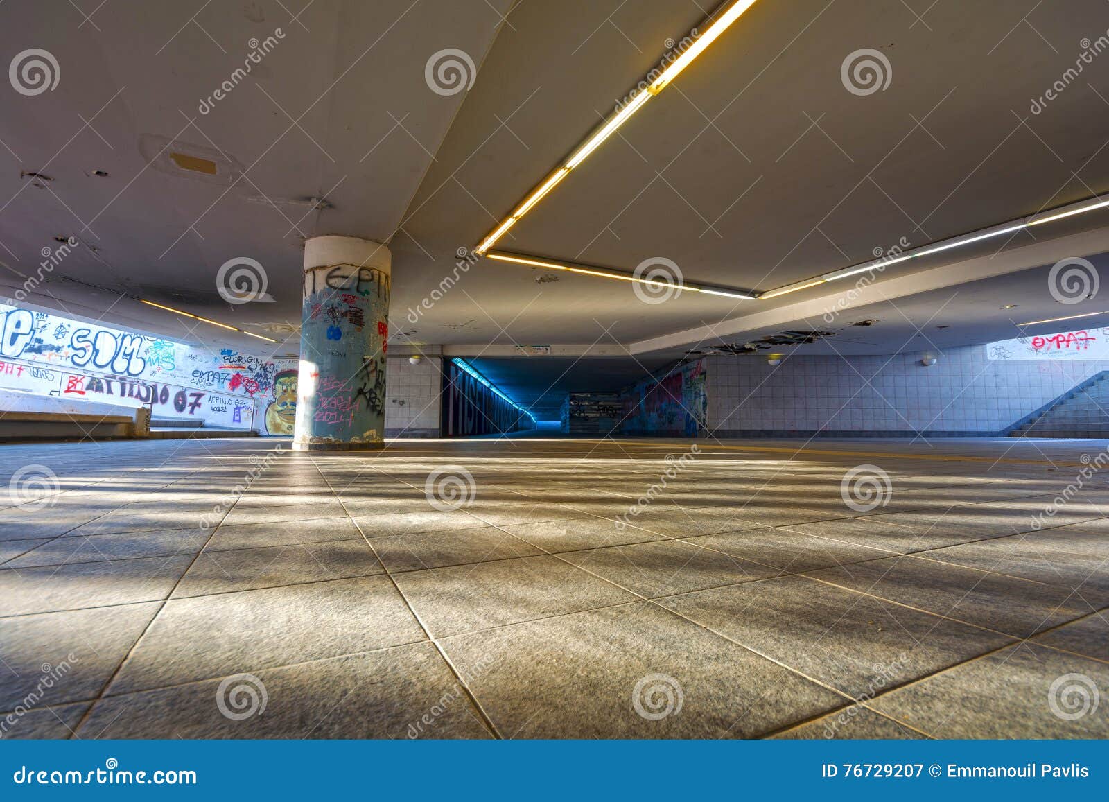Underground Passage With Metal Stairs Leading To A Building Covered In ...