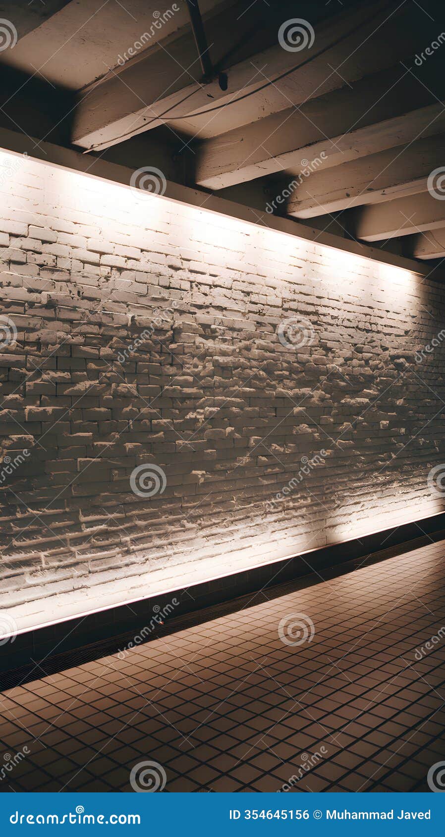 Illuminated White Brick Wall in an Industrial Underground Setting Stock ...