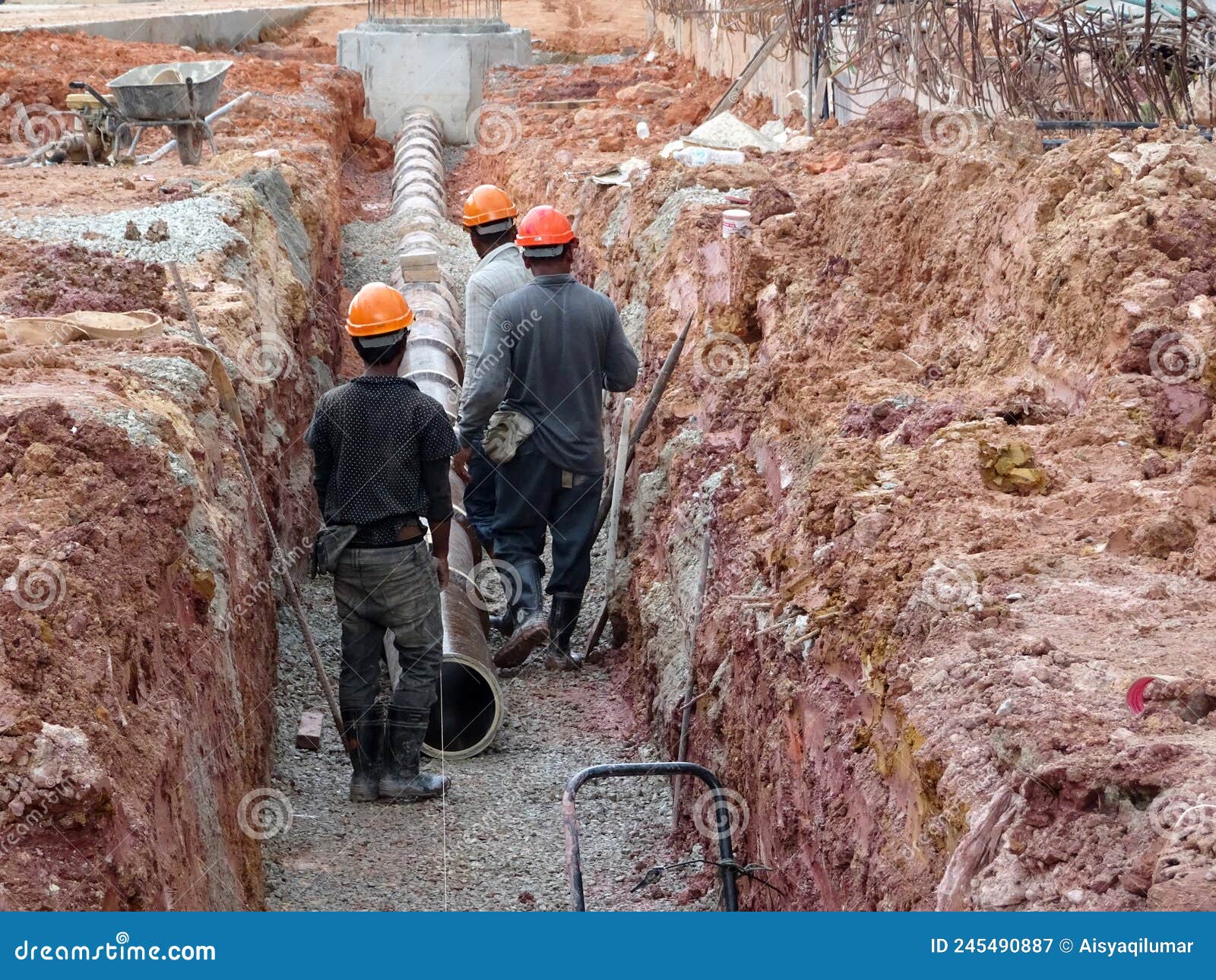 Underground Sewerage Pipe Installed by Construction Workers at the ...