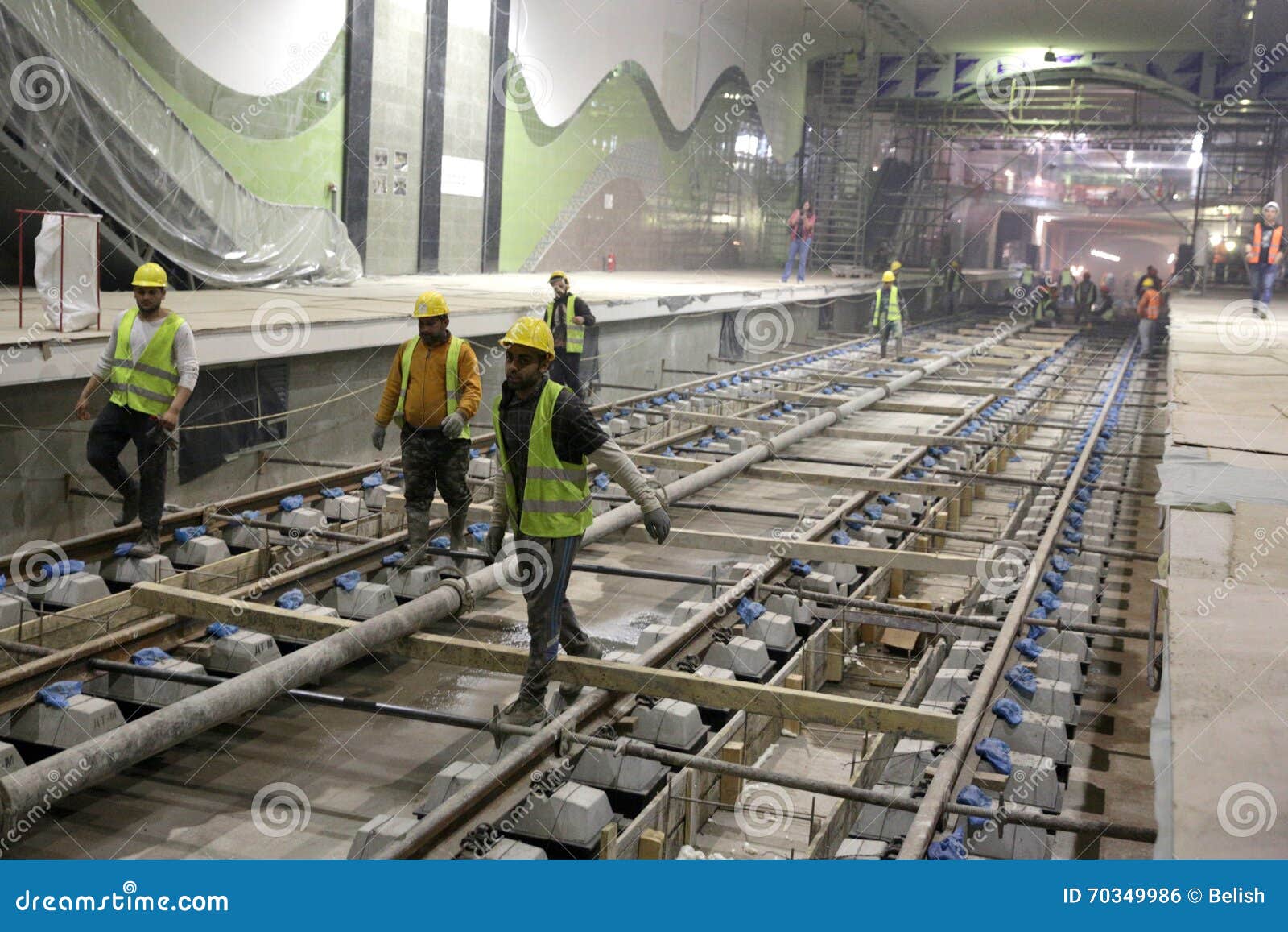 Tunneller Worker Installing Fixture In Underground Subway Metro ...
