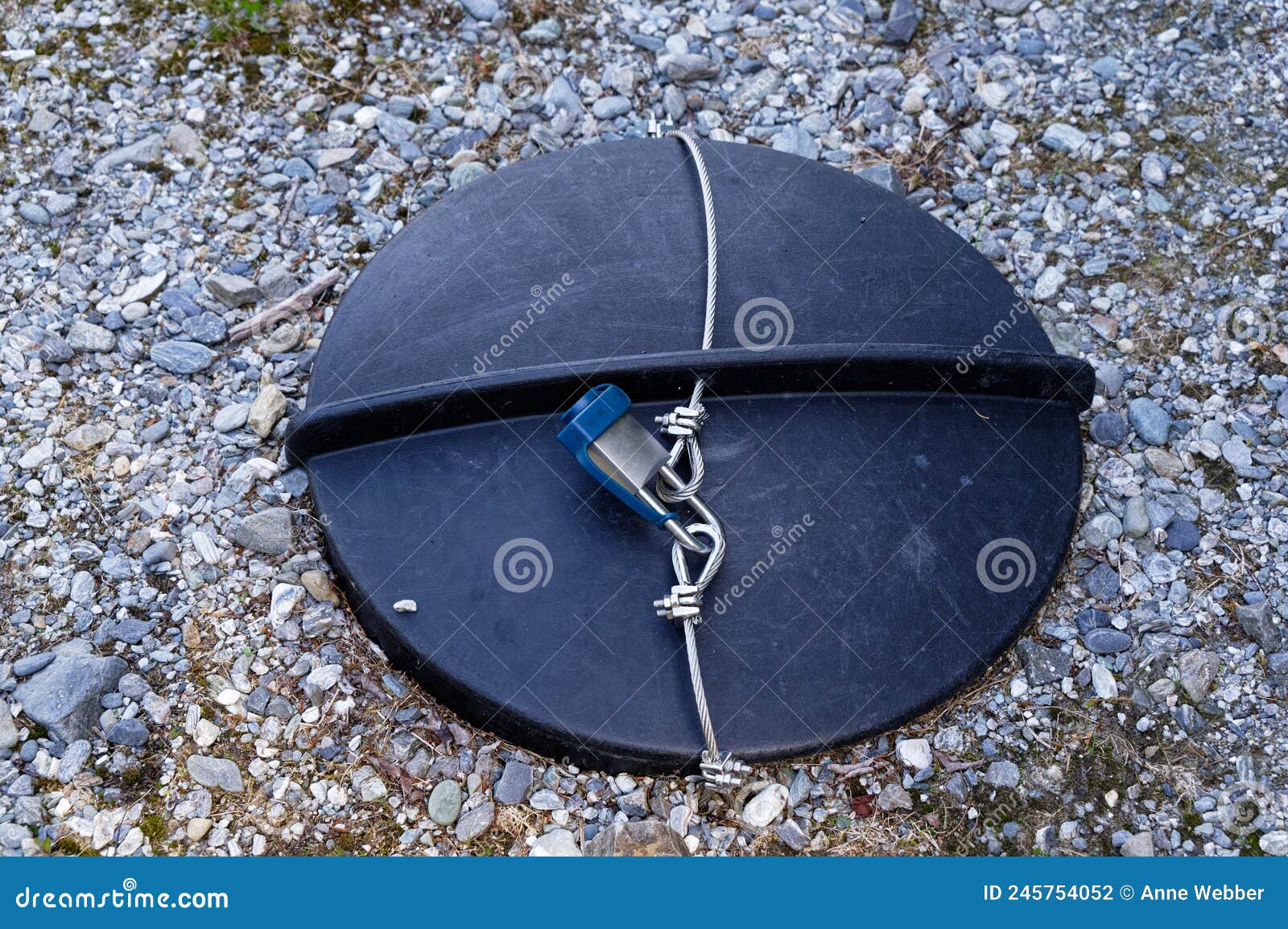 An Underground Tank`s Lid is Secured with a Steel Cable and a Lock ...