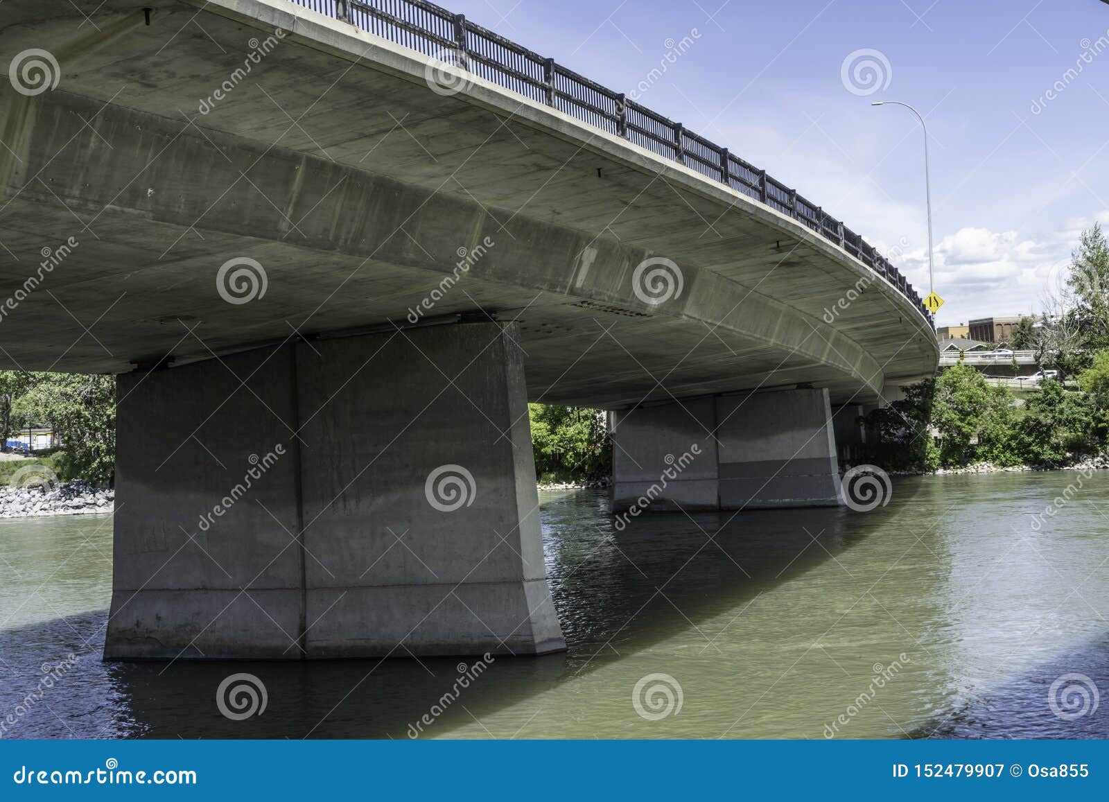 Underside of Bridges Crossing Over a River in City Stock Image - Image ...