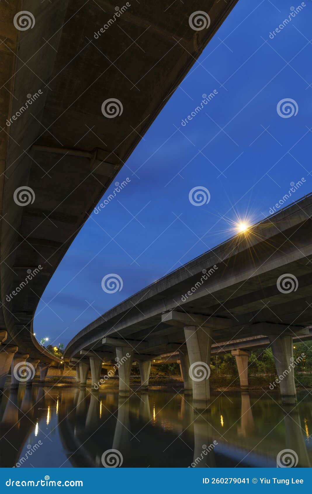 Underside of an Elevated Road Across River at Dusk Stock Image - Image ...