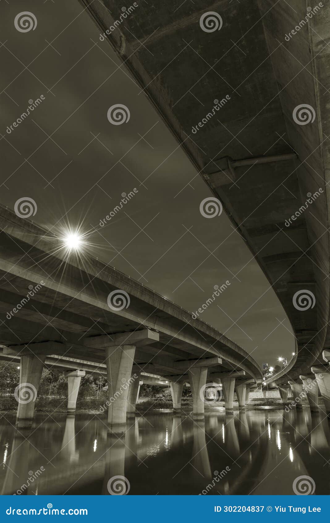 Underside of an Elevated Road Across River at Dusk Stock Image - Image ...