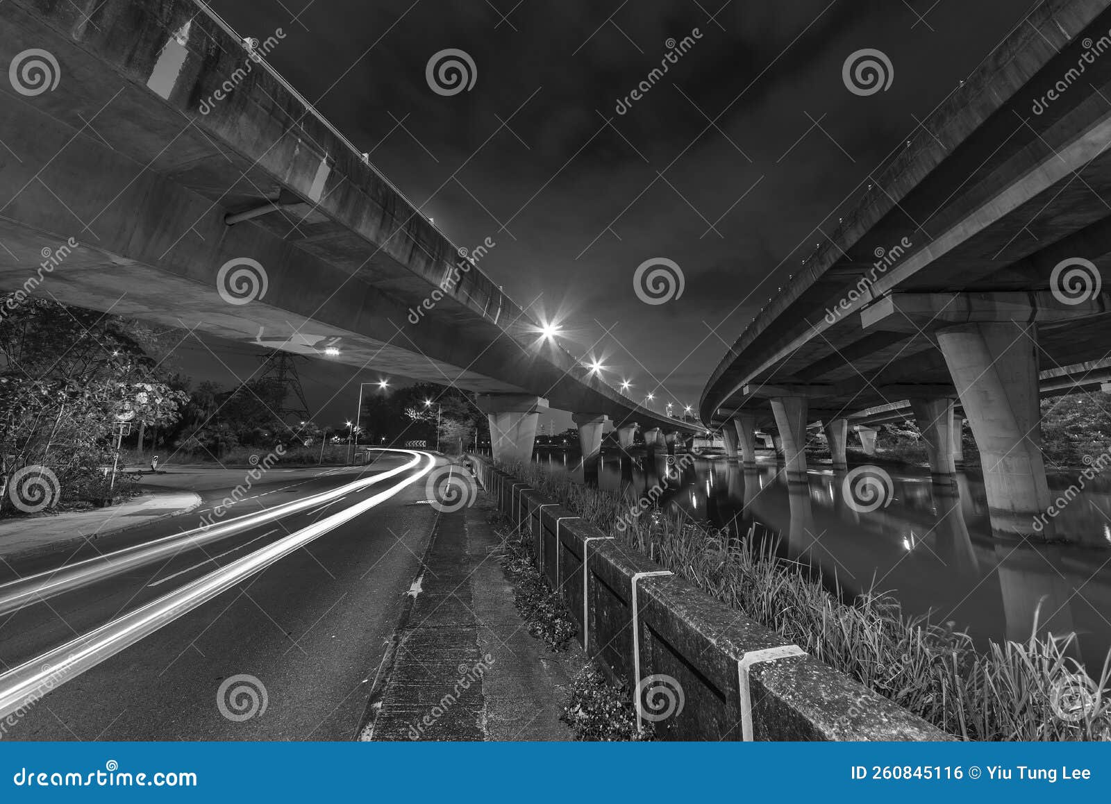 Underside of an Elevated Road Across River at Night Stock Photo - Image ...