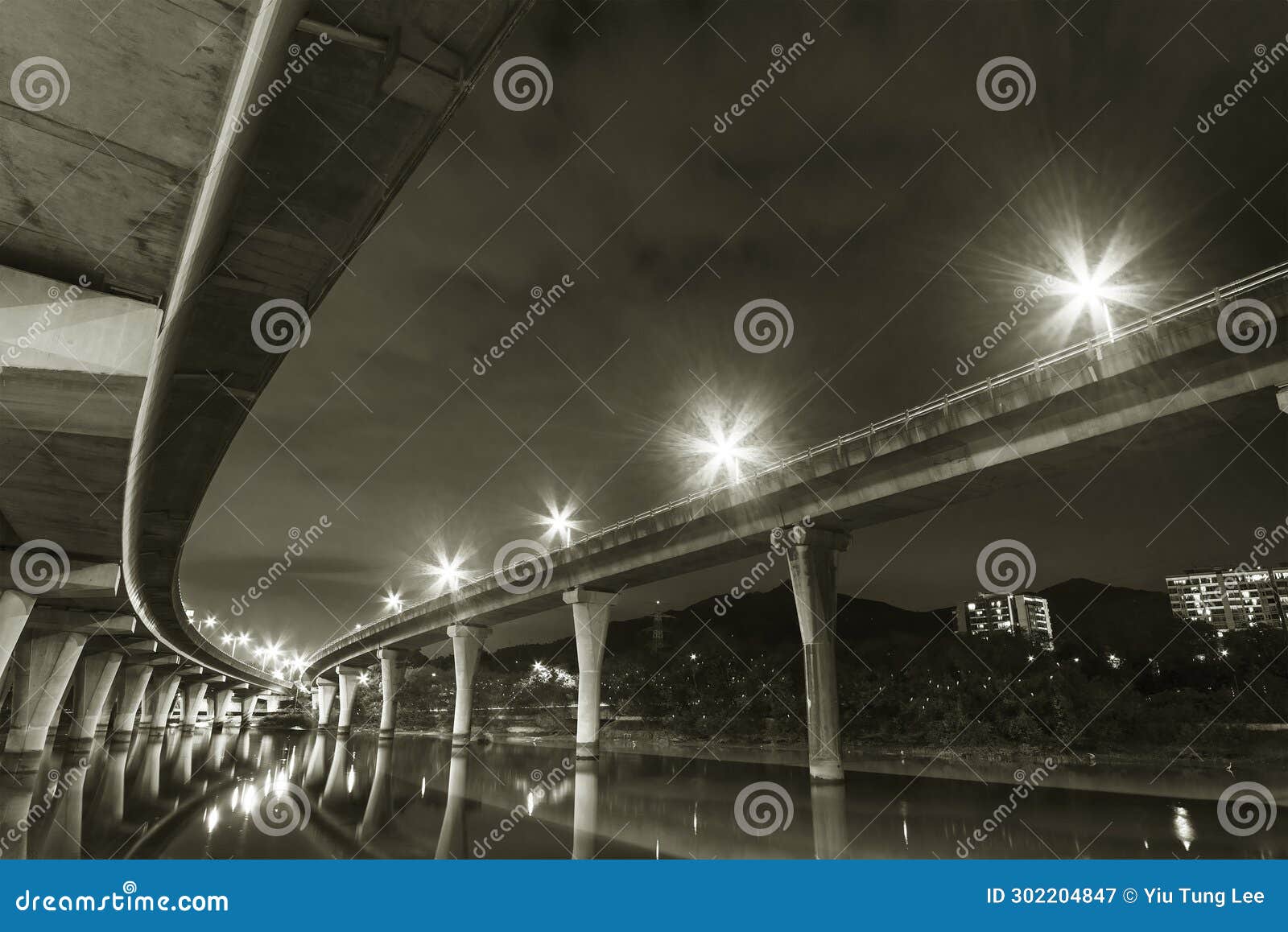 Underside of an Elevated Road Across River at Night Stock Image - Image ...