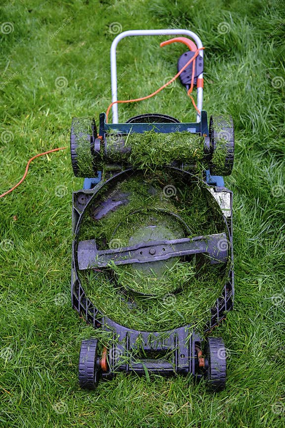 Underside of a Lawn Mower in Long Grass Stock Image - Image of damaded ...