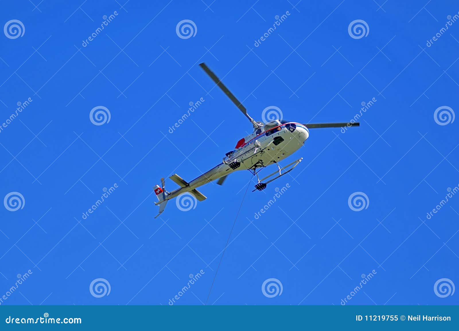 Underside of Utility Helicopter with Lifting Cable Stock Image - Image ...