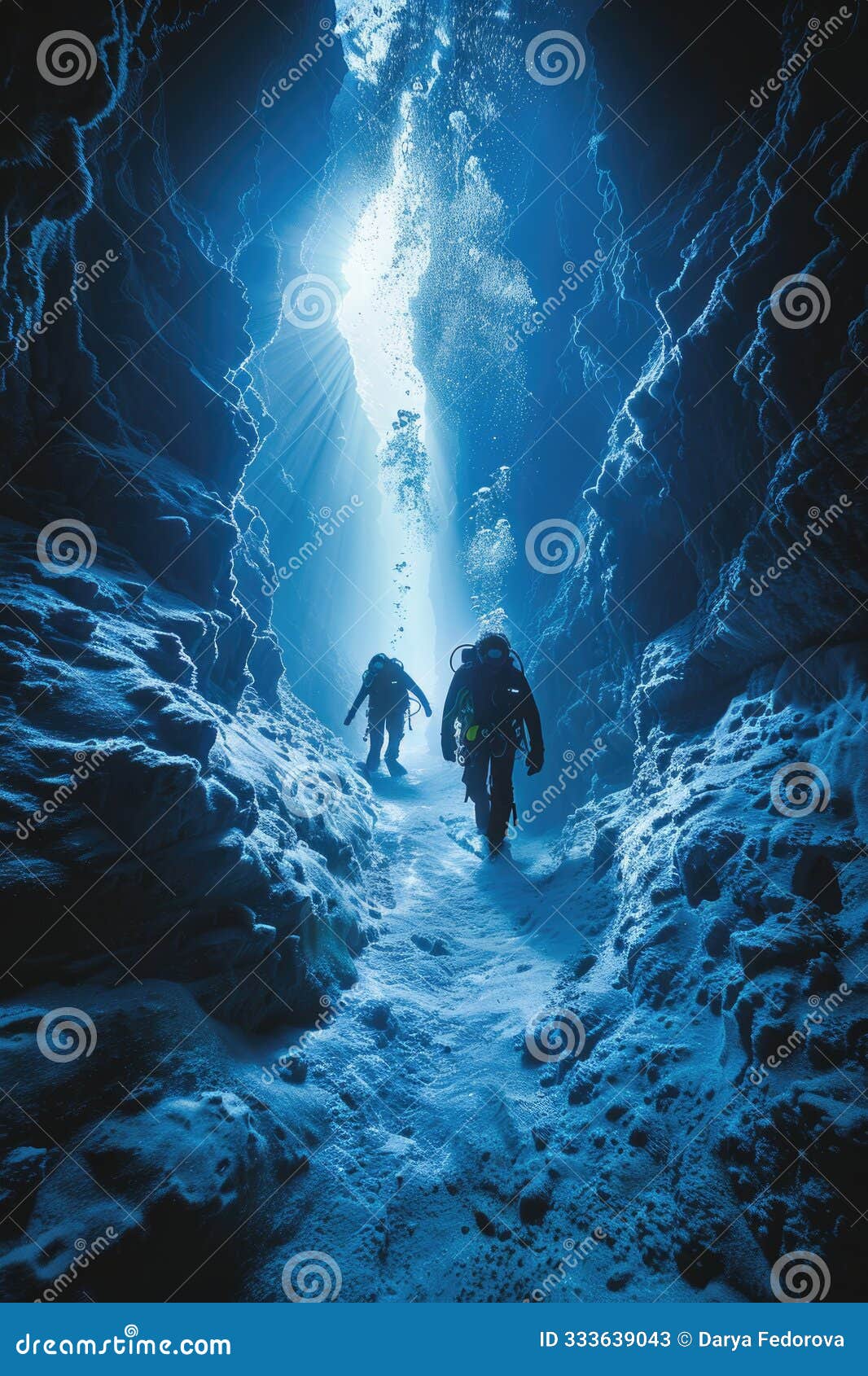 Underwater Cave Divers Exploring Deep Sea Caverns with Sunlight Beaming ...