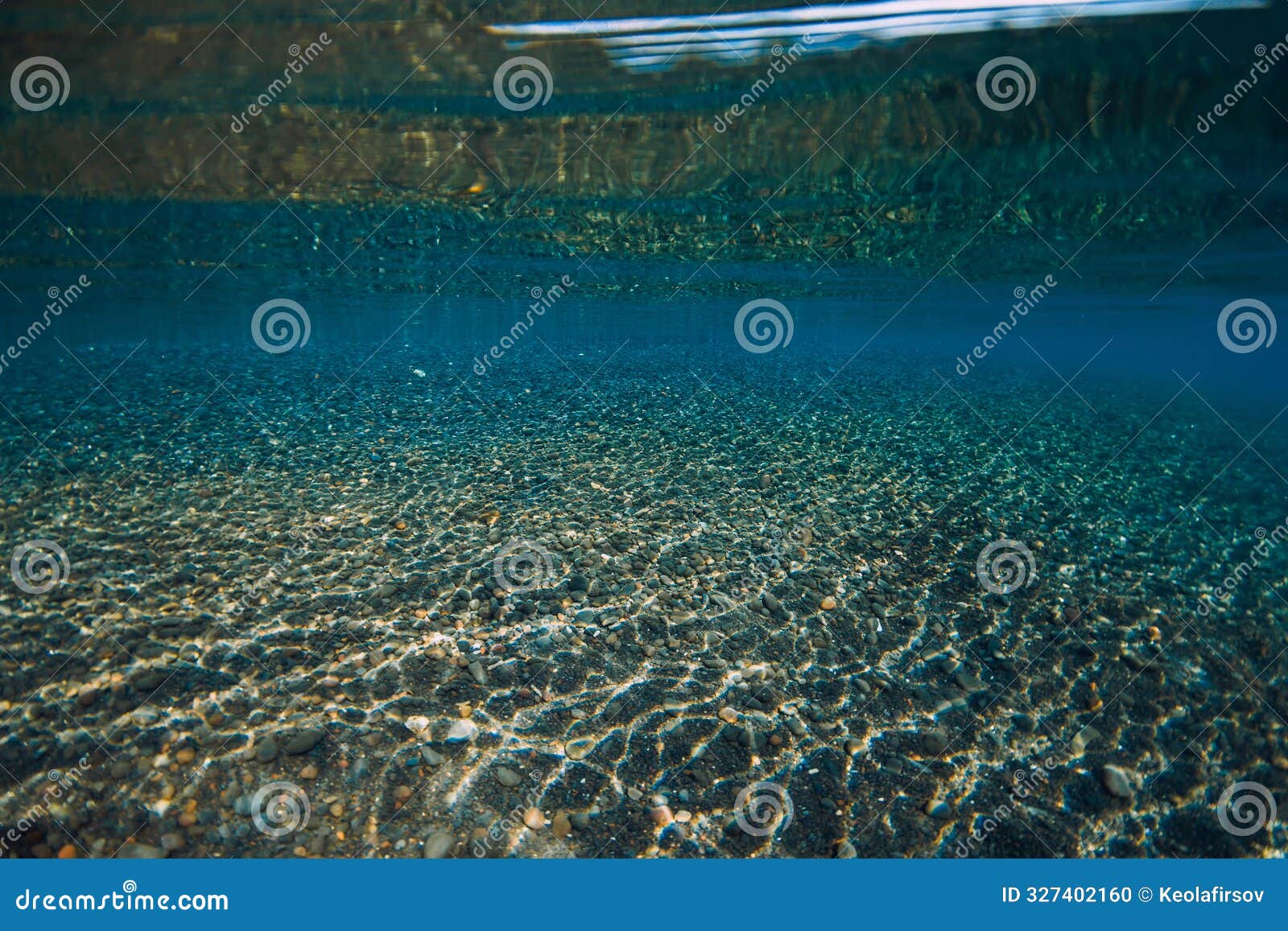 Underwater Crystal Ocean with Stone Bottom and Reflection on Surface ...
