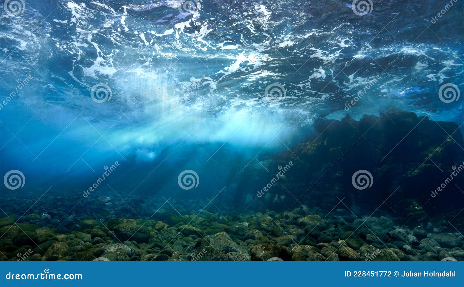 Underwater Rays of Light Breaking through the Waves Stock Photo - Image ...