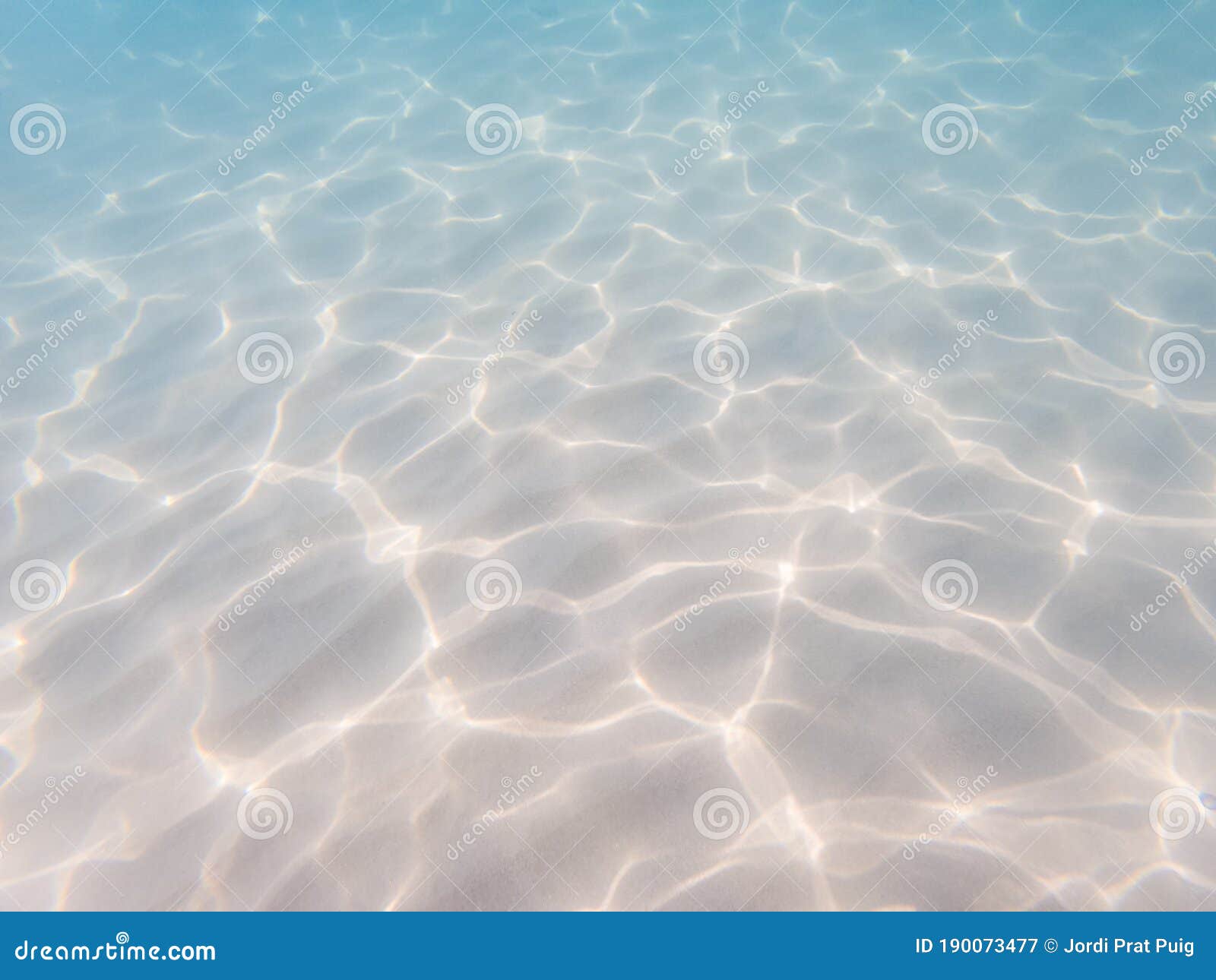 Underwater Still of the Water Waves Reflection on White Sand in the ...