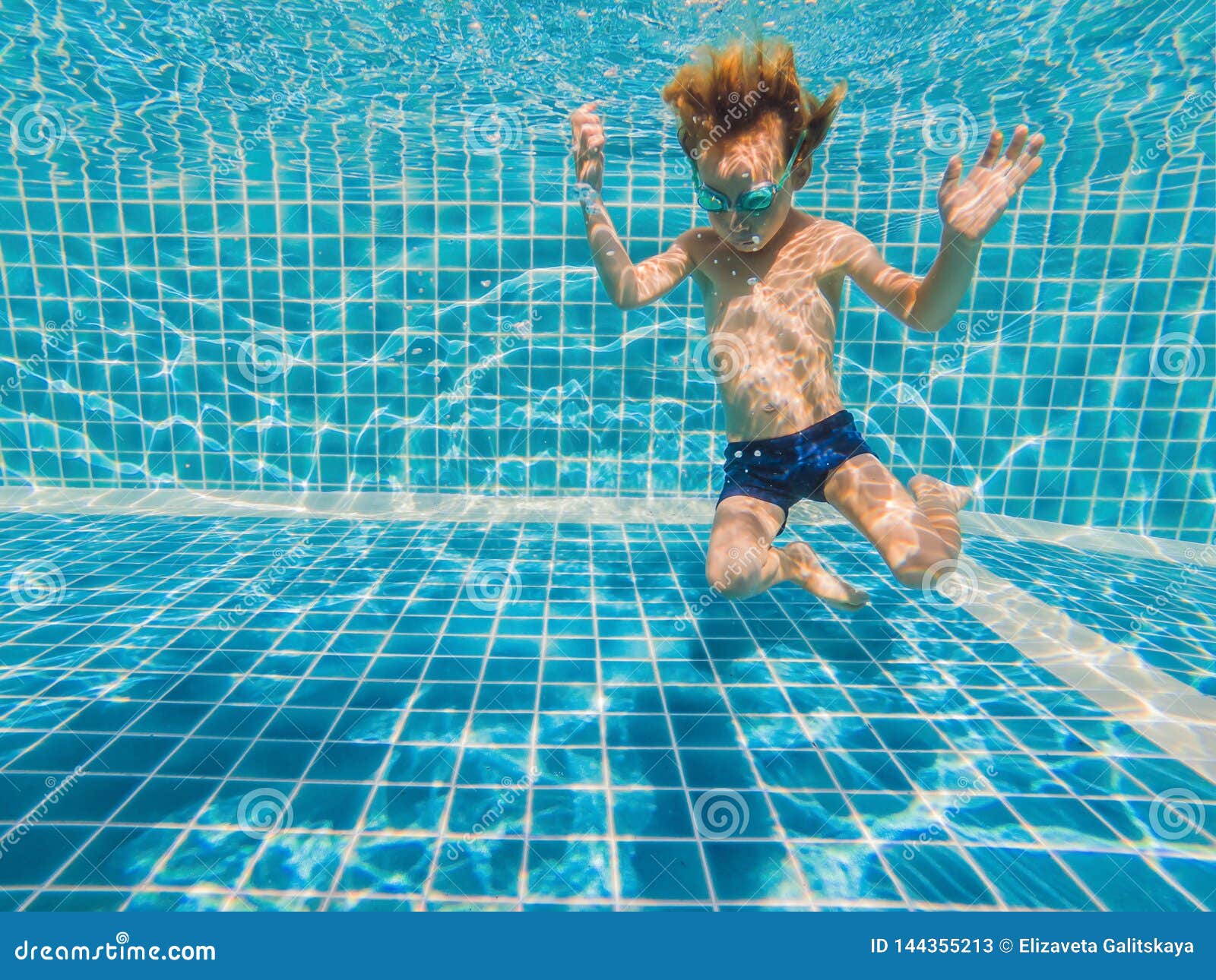 Underwater Young Boy Fun in the Swimming Pool with Goggles. Summer ...