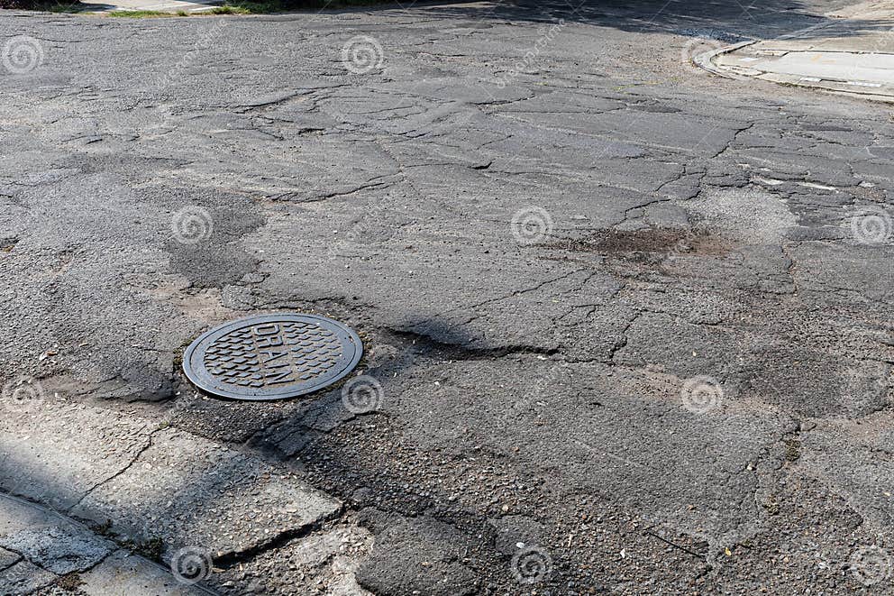 Undulating Asphalt with Patch Layers Crumbling, Manhole Drain Creative ...