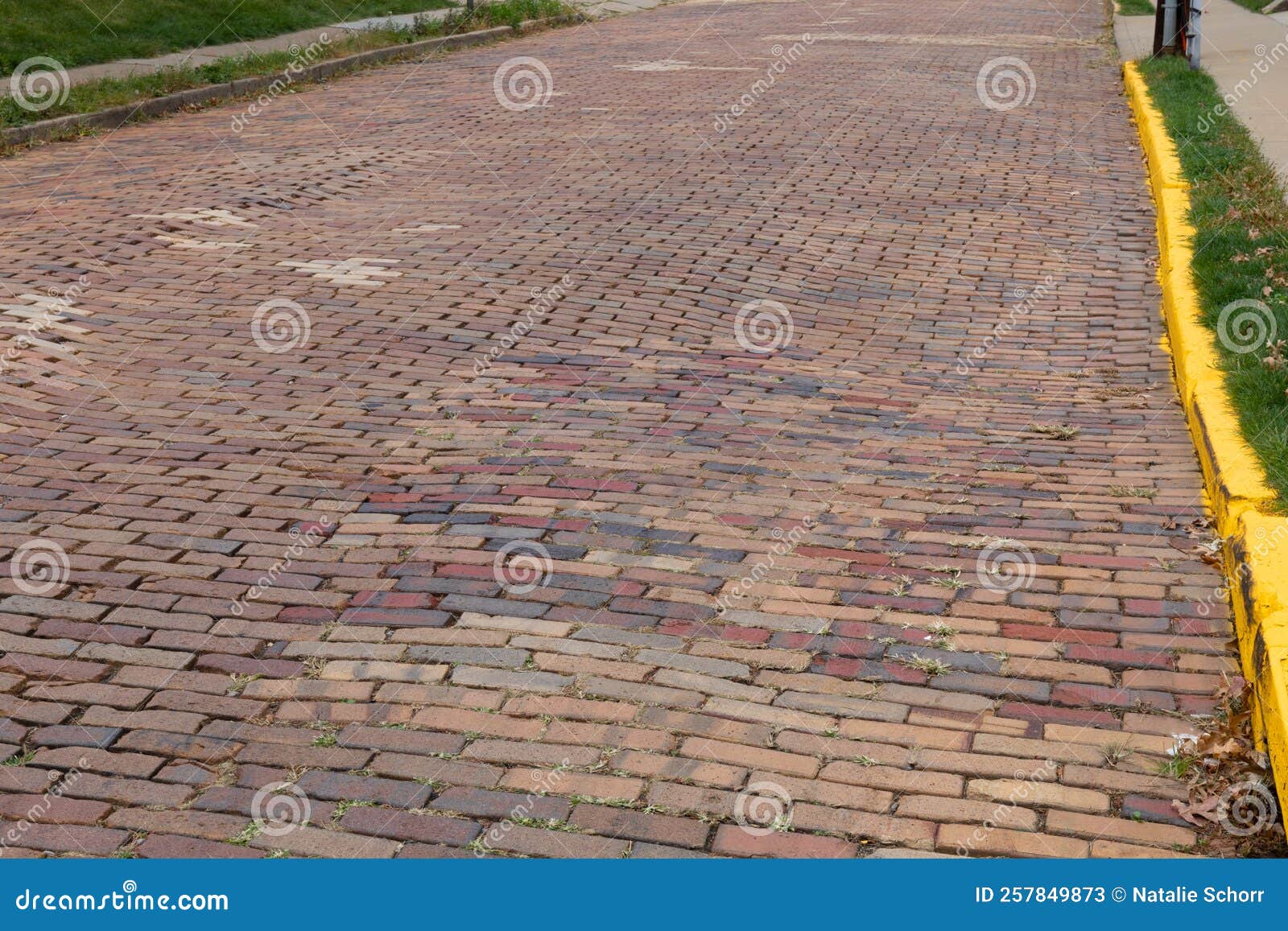 Undulating Surface of a Brick Roadway Patched with a Variety of ...