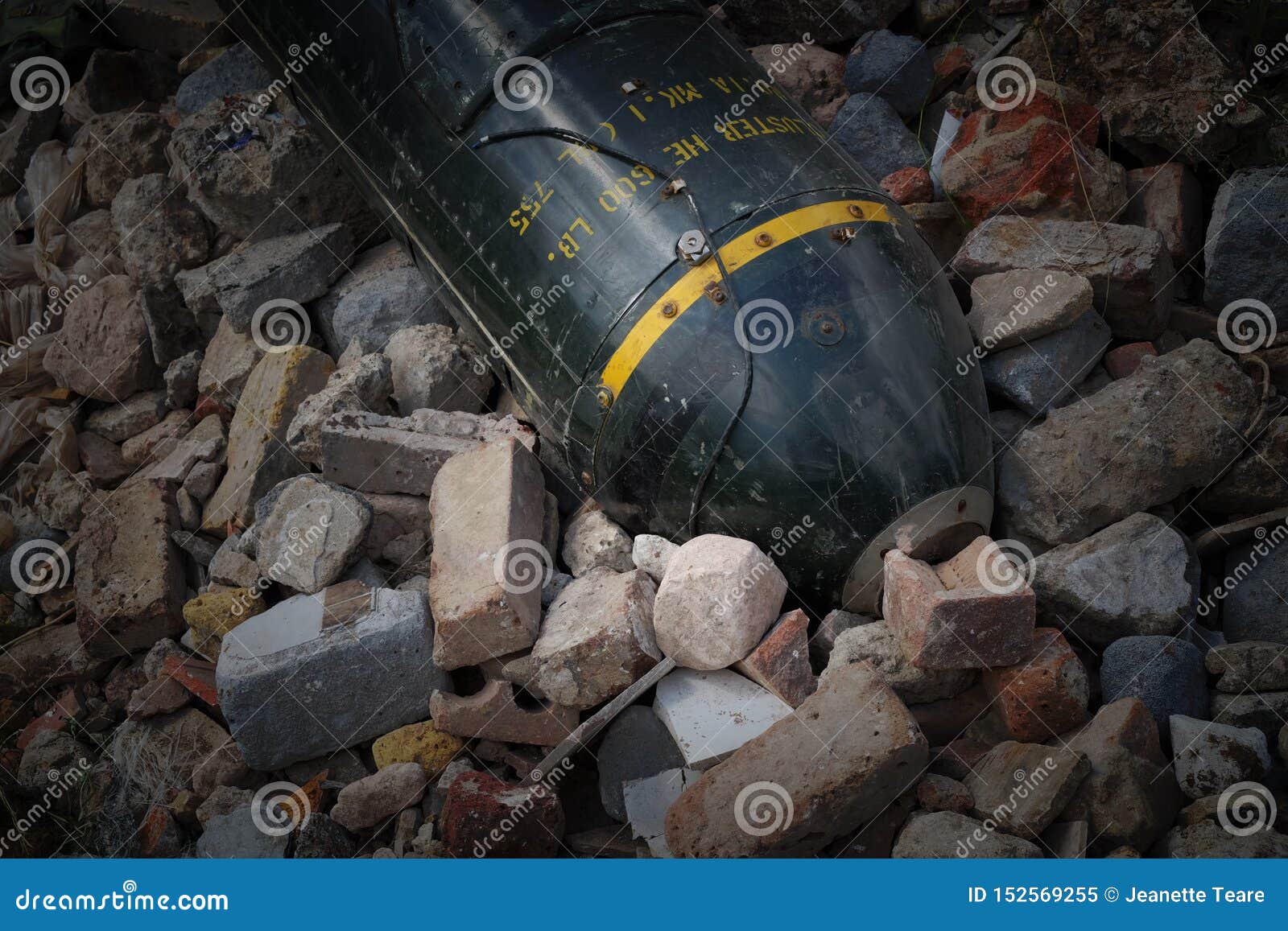 Unexploded Bomb, Green Missile Case in Rubble, Danger of War Stock ...