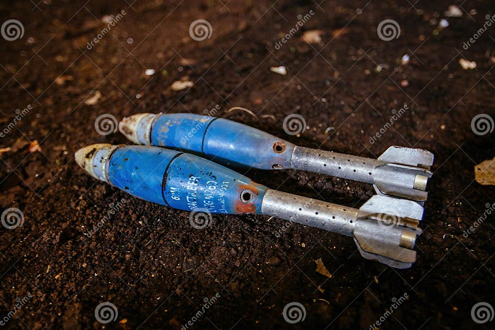 Unexploded Mortar Mines on Ground. War Actions Aftermath Stock Image ...