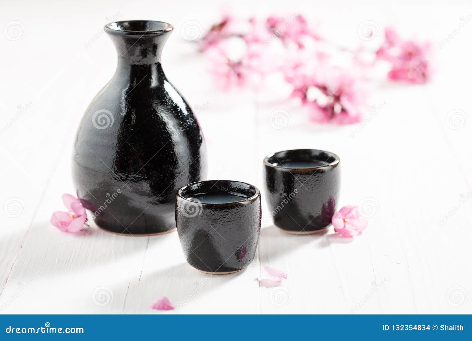 Unfiltered White Sake with Flowers of Blooming Cherry Stock Photo ...