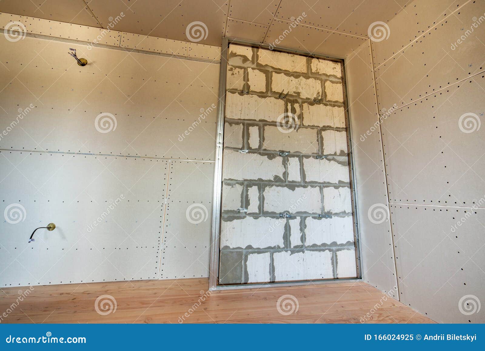Unfinished Brick Wall in a Room Under Construction Prepared for Drywall ...
