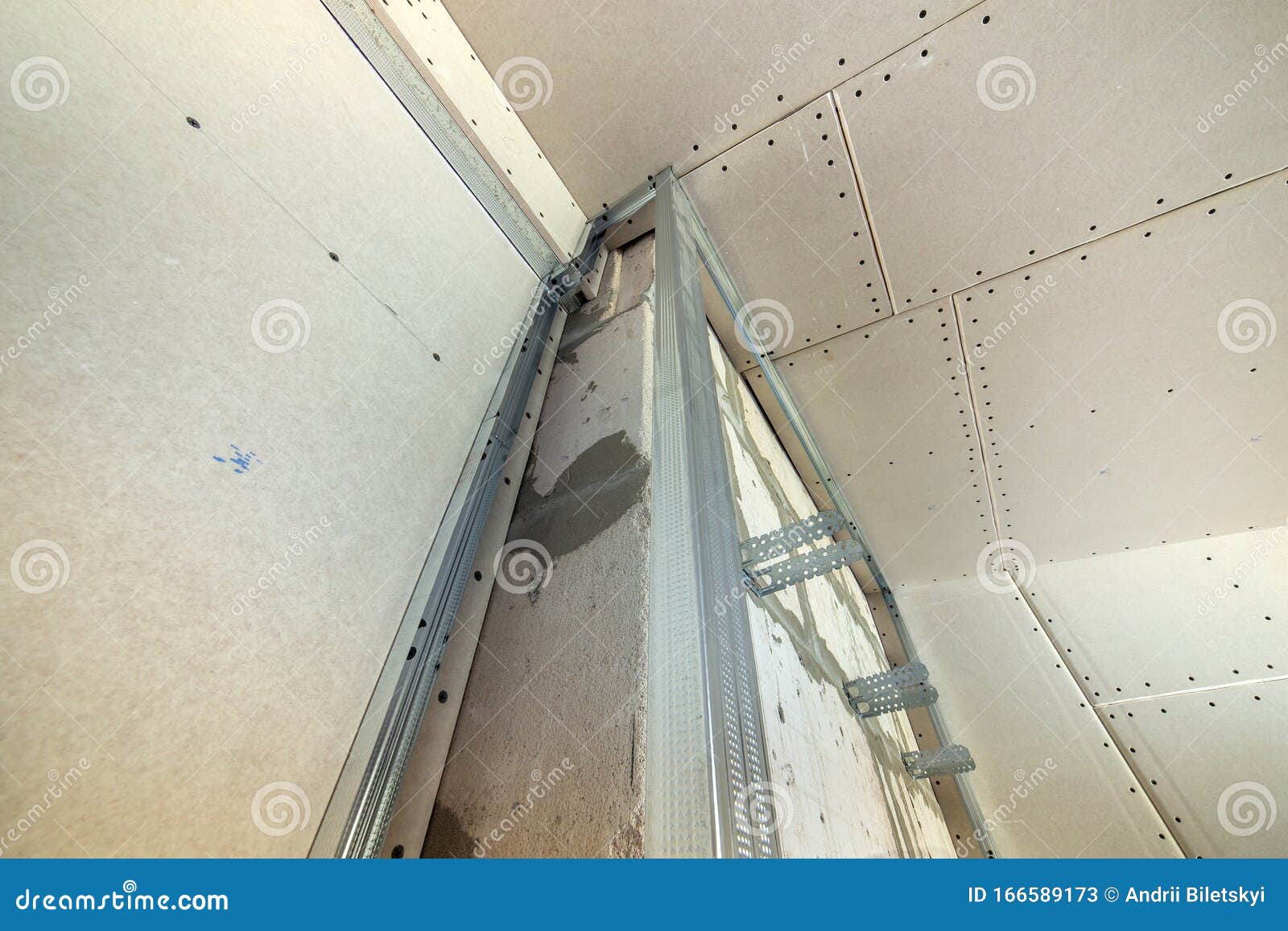 Unfinished Brick Wall in a Room Under Construction Prepared for Drywall ...