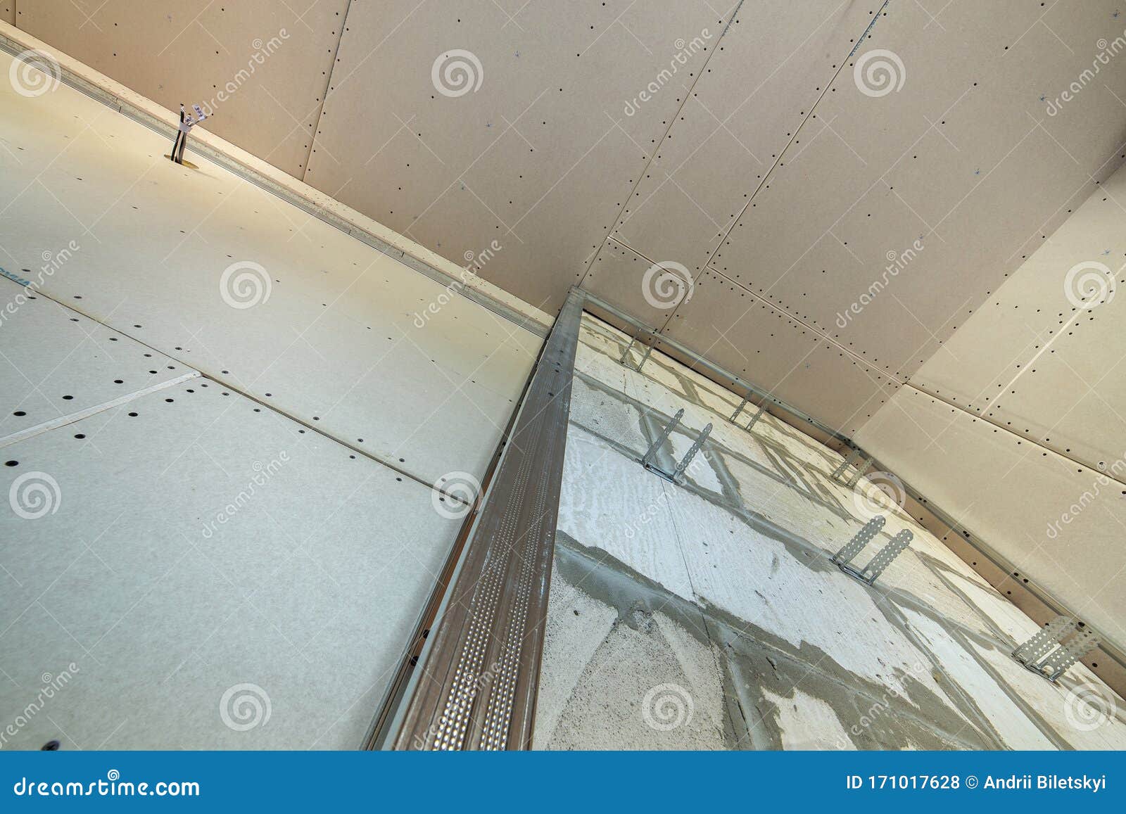 Unfinished Brick Wall in a Room Under Construction Prepared for Drywall ...