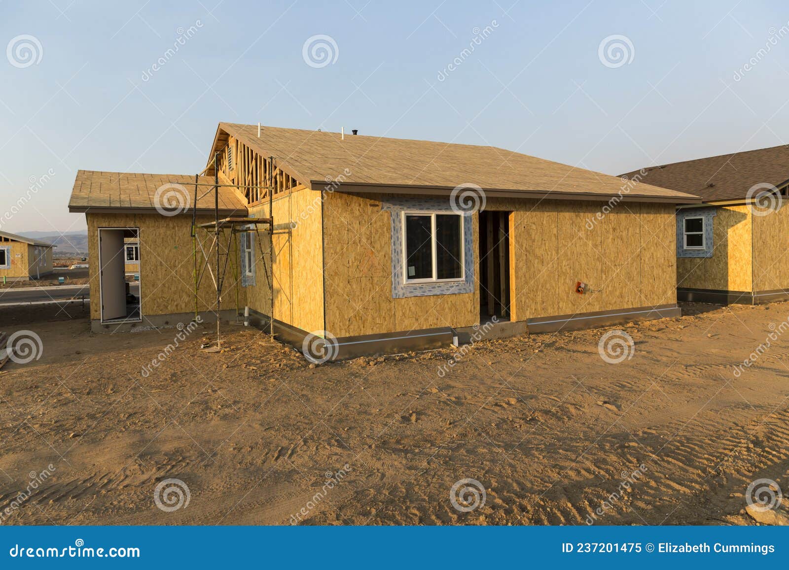 Unfinished Housing on the Dirt Lot Back View with Doors Open Stock ...