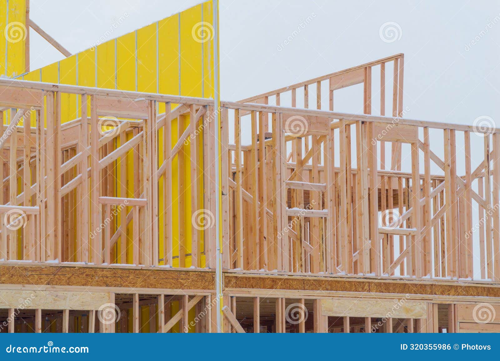 In Unfinished Interior of Newly Built House, Timber Studs Support a ...