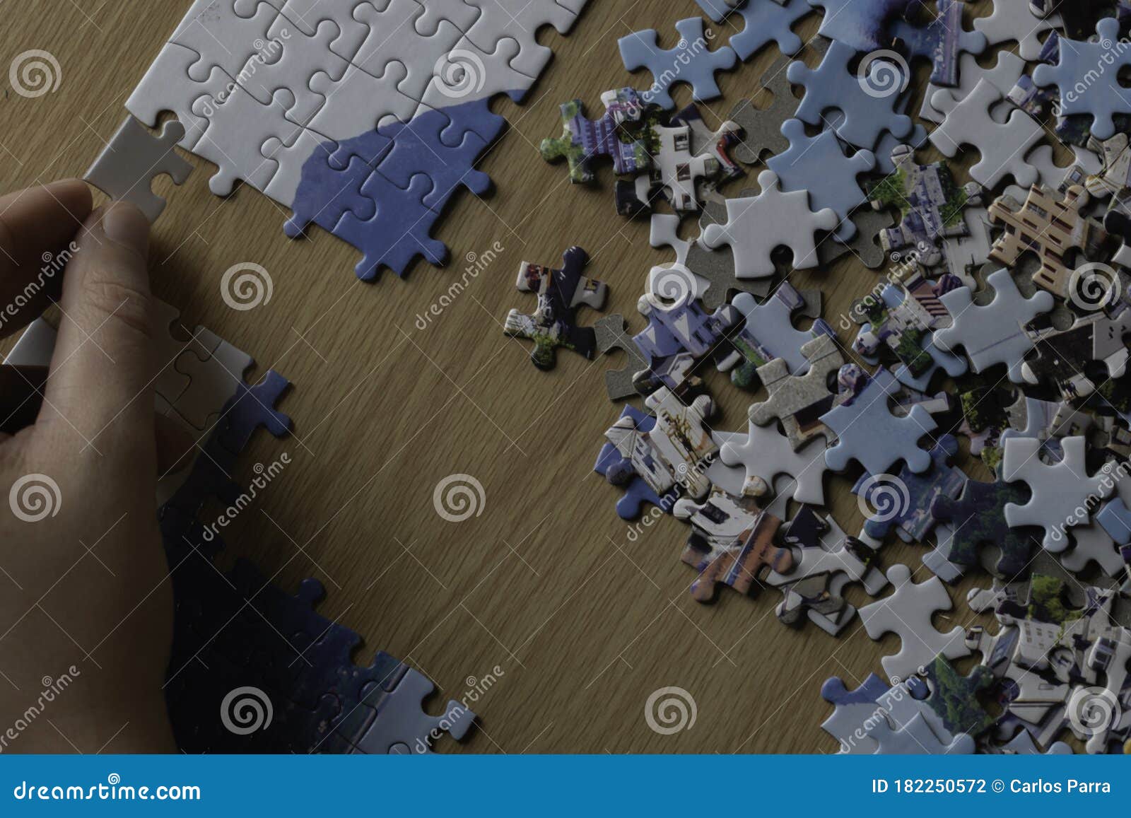 Unfinished Puzzle Over a Wooden Table Stock Photo - Image of mess ...