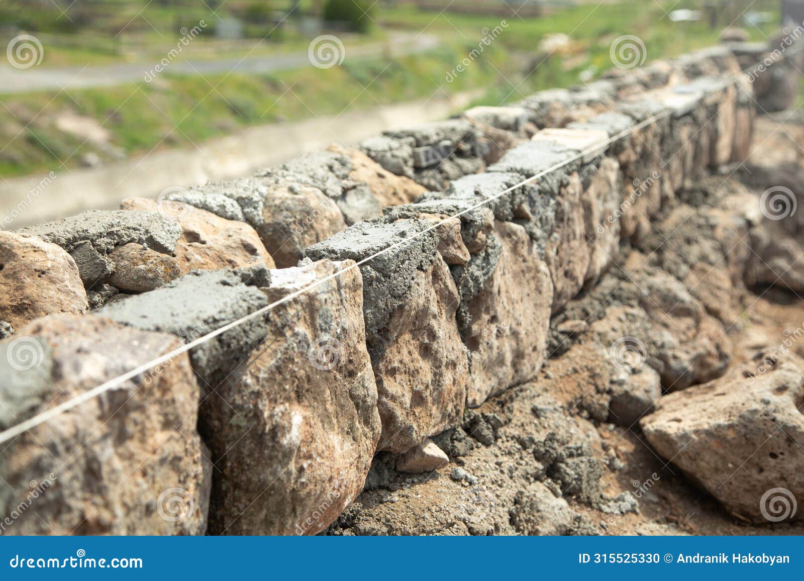 Unfinished Rough Stone Wall in Outdoor. Construction Stock Photo ...