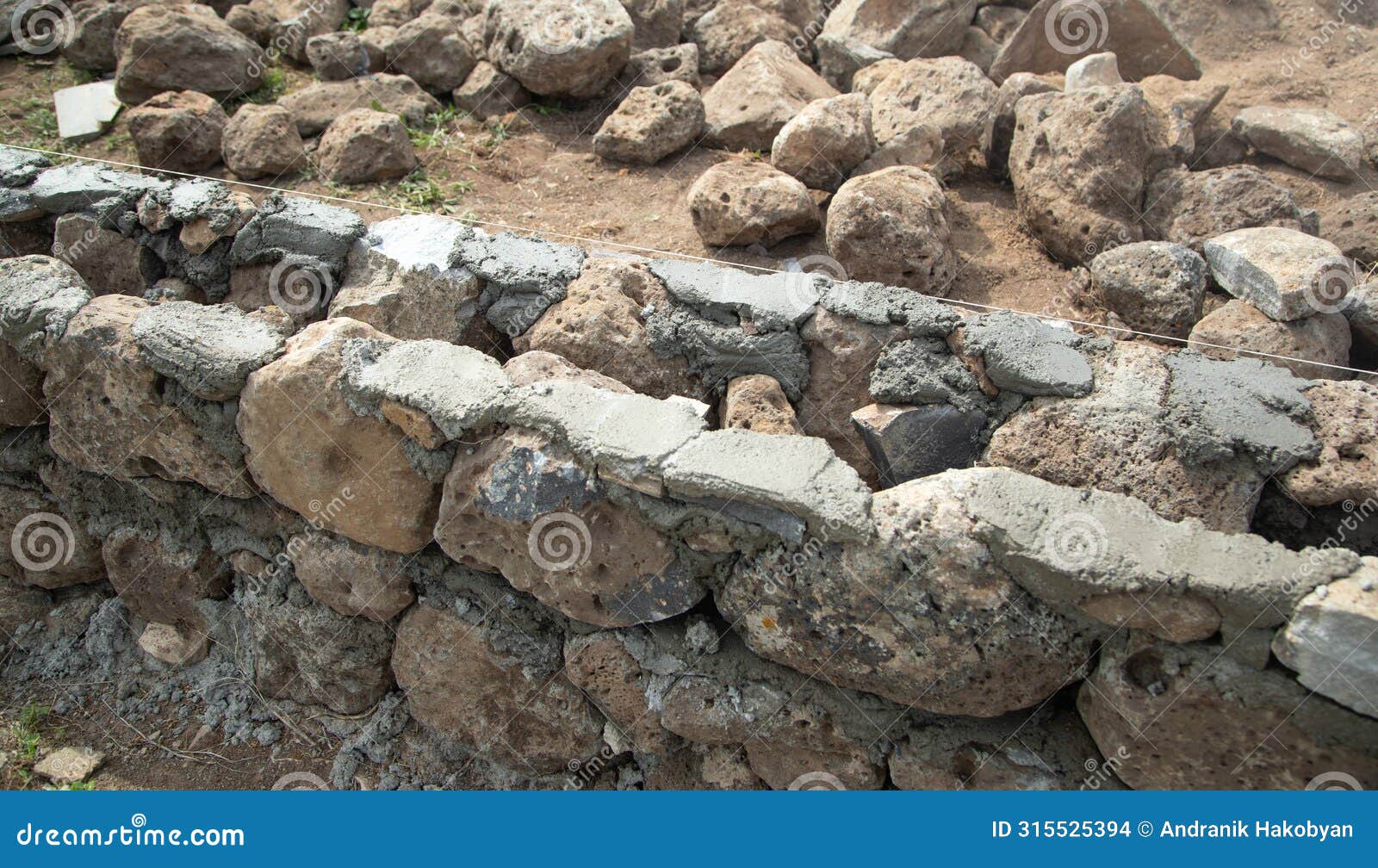 Unfinished Rough Stone Wall in Outdoor. Construction Stock Photo ...