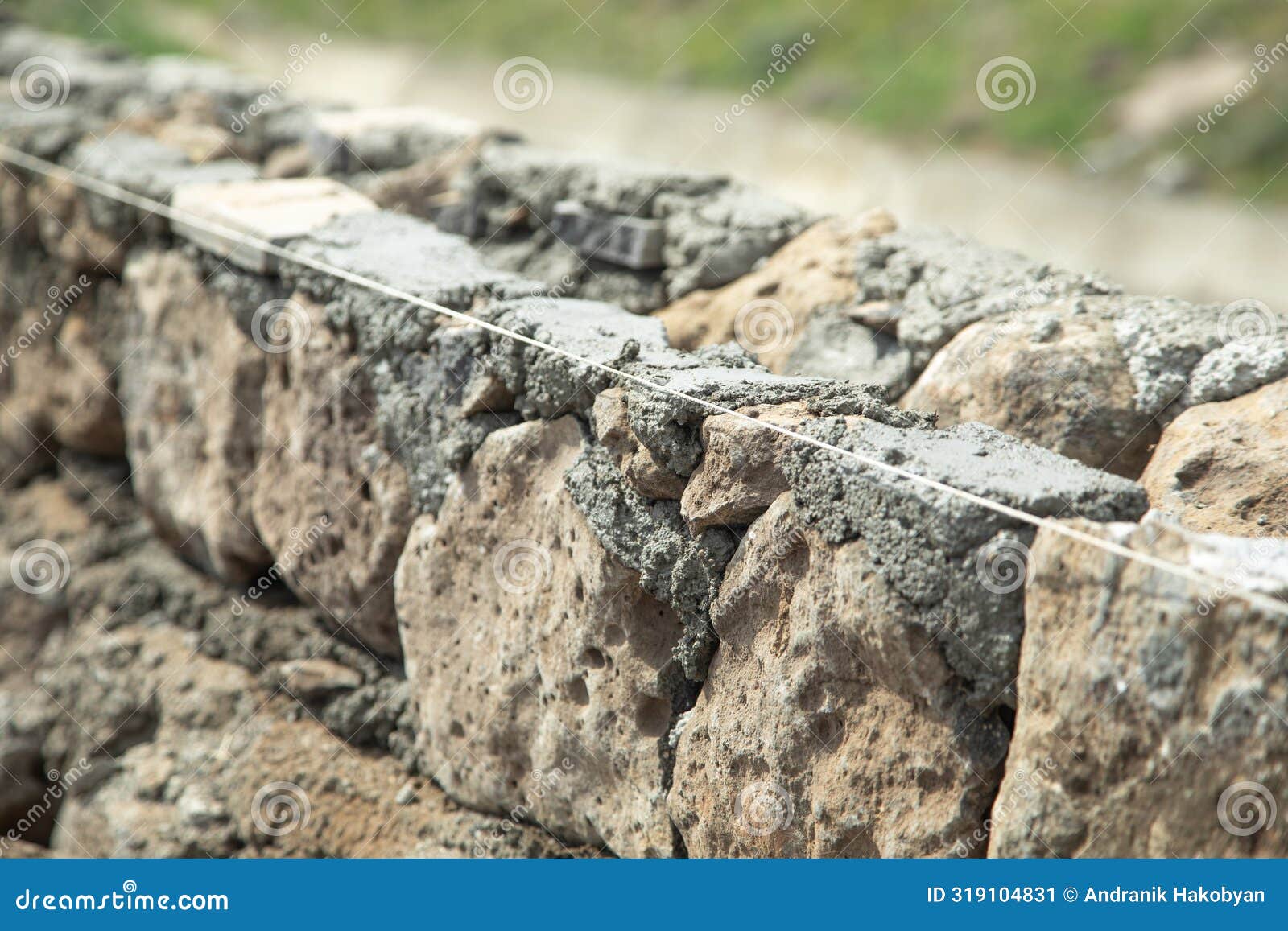 Unfinished Rough Stone Wall in Outdoor. Construction Stock Image ...