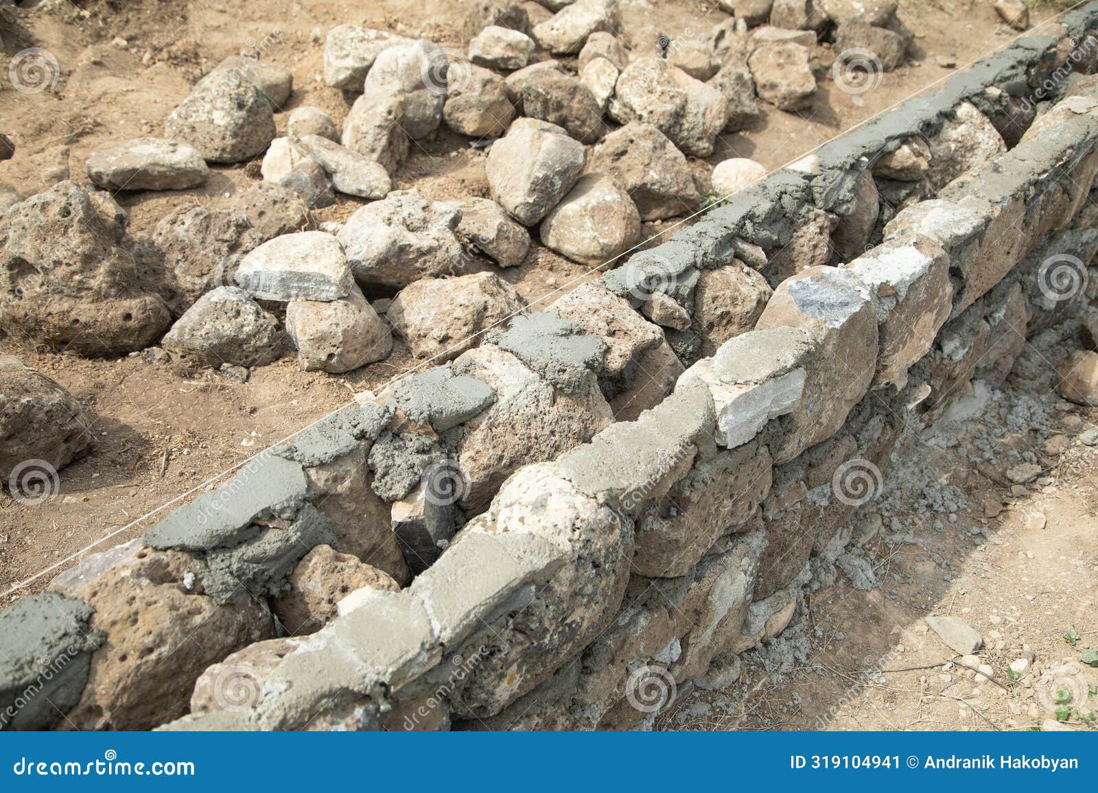 Unfinished Rough Stone Wall in Outdoor. Construction Stock Image ...