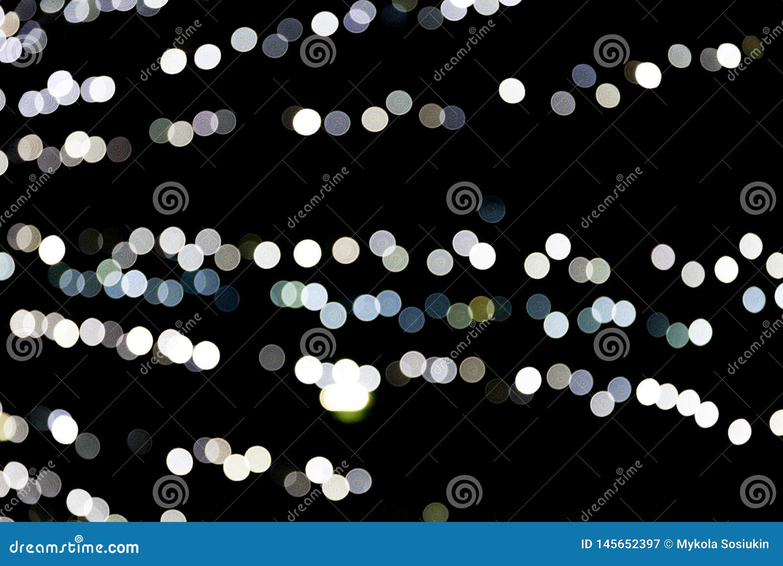 Unfocused Abstract White Bokeh on Black Background. Defocused and ...