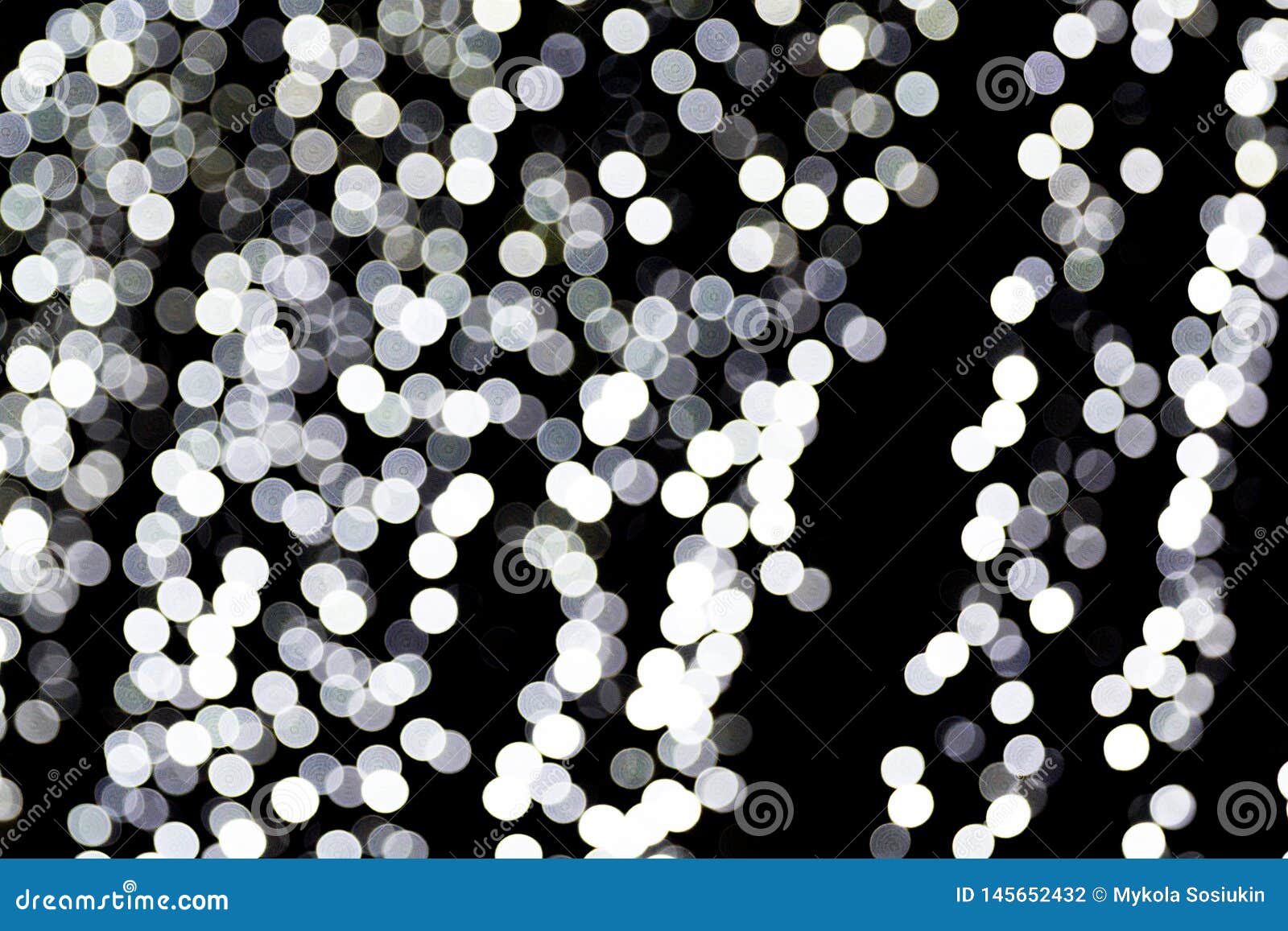 Unfocused Abstract White Bokeh on Black Background. Defocused and ...